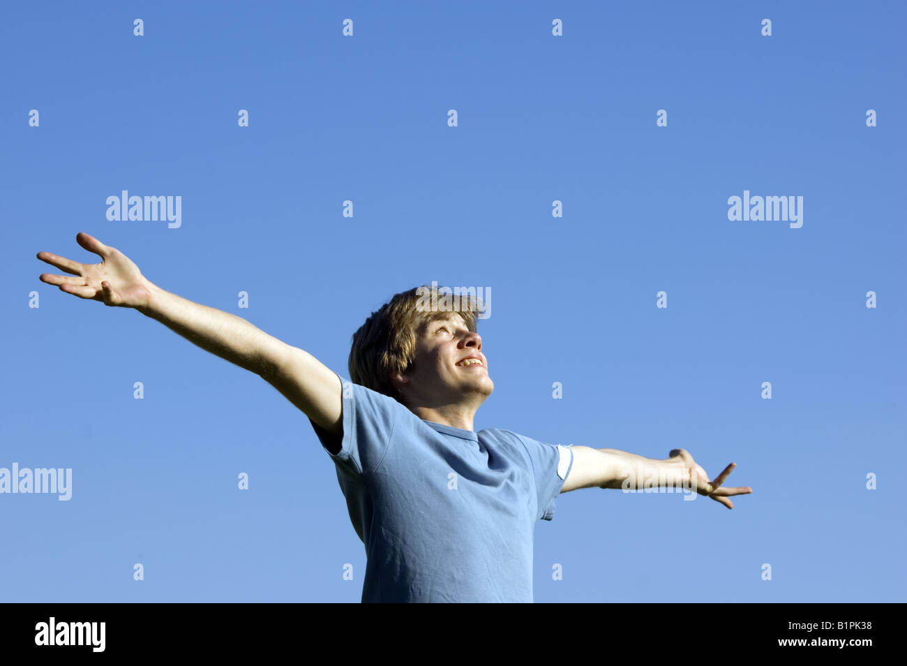 Active boy showing happiness Stock Photo - Alamy