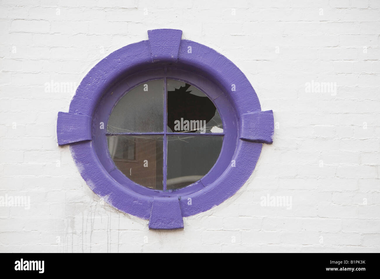 A broken window in Bolton Lancashire UK Stock Photo - Alamy