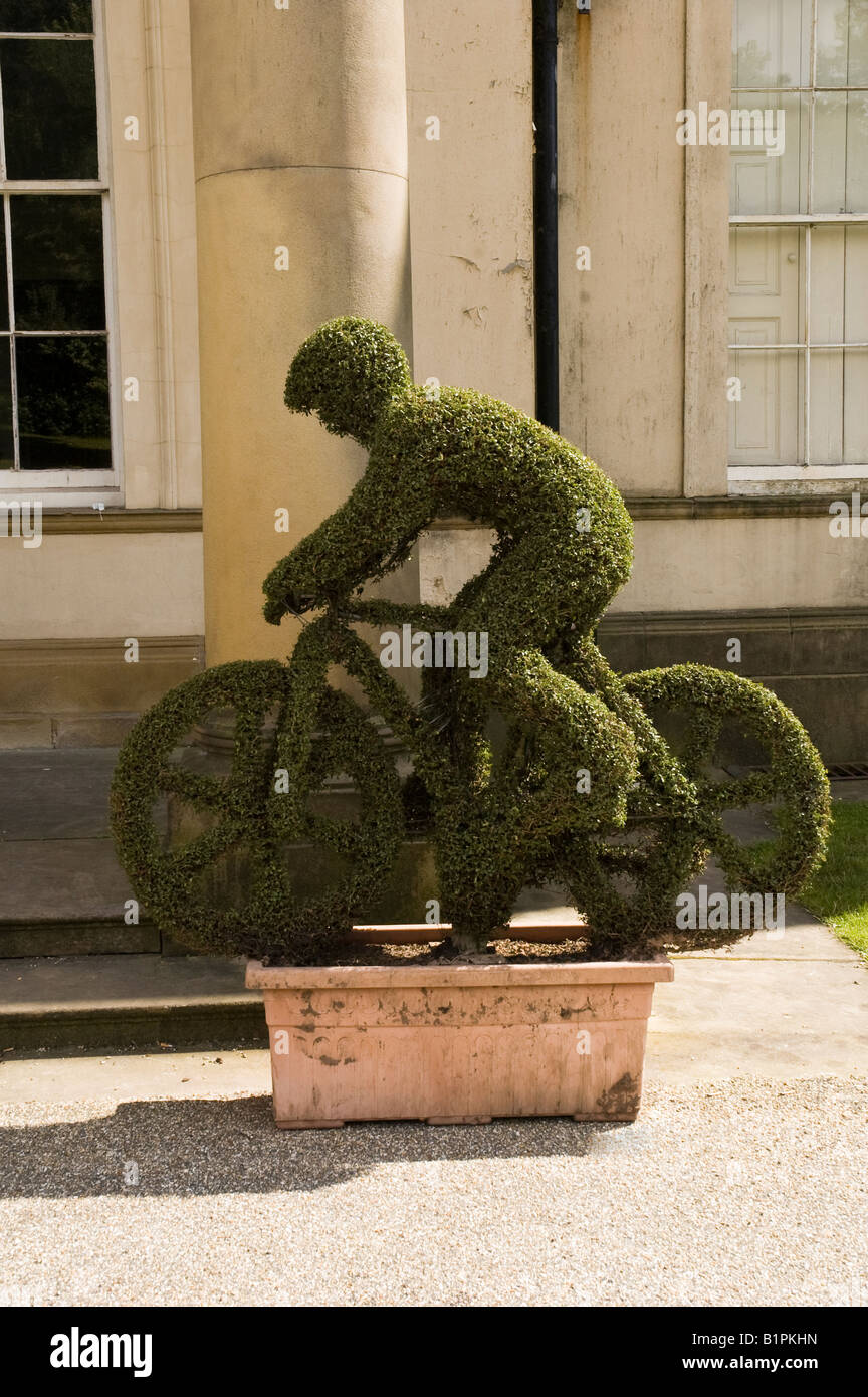 Topiary man riding a bike in Heaton Park Stock Photo - Alamy