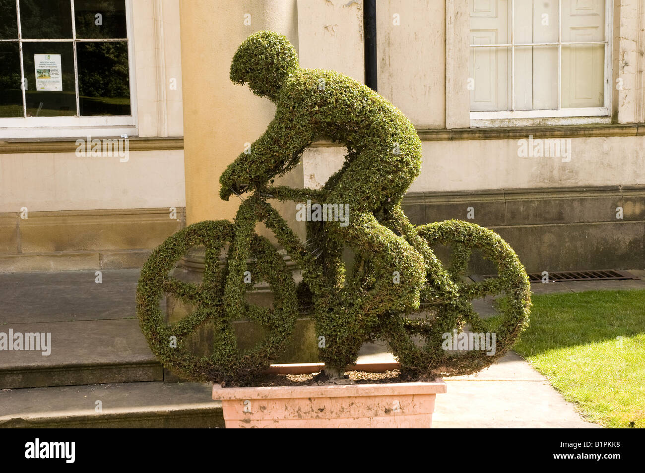 Topiary man riding a bike in Heaton Park Stock Photo - Alamy