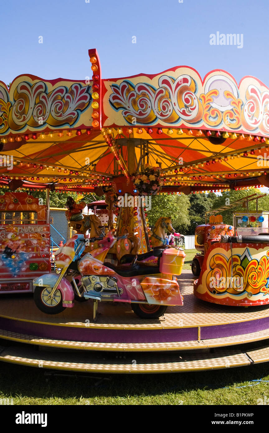 Merry-go-round at a fair Stock Photo - Alamy