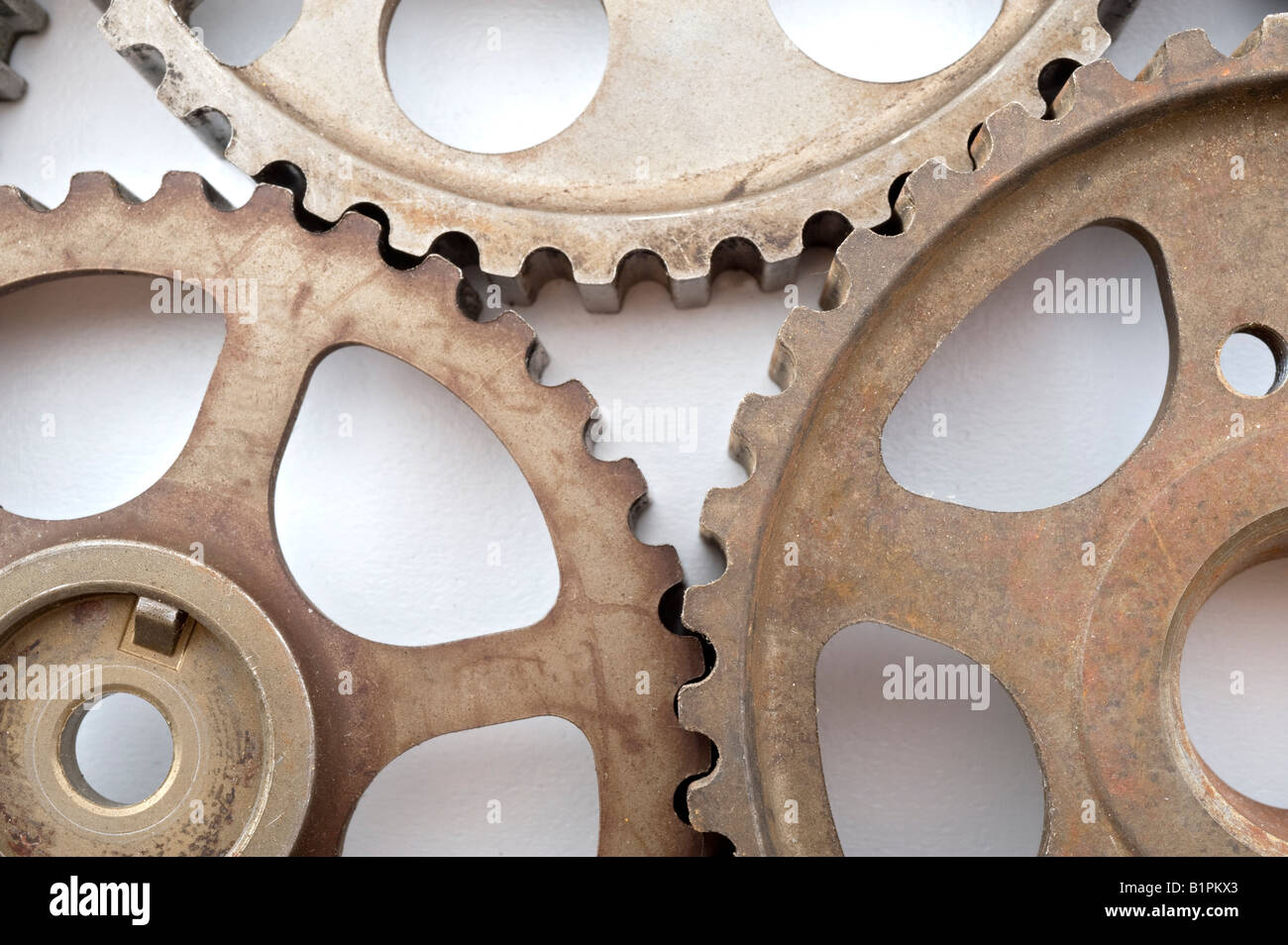three cogwheels isolated on white Stock Photo - Alamy