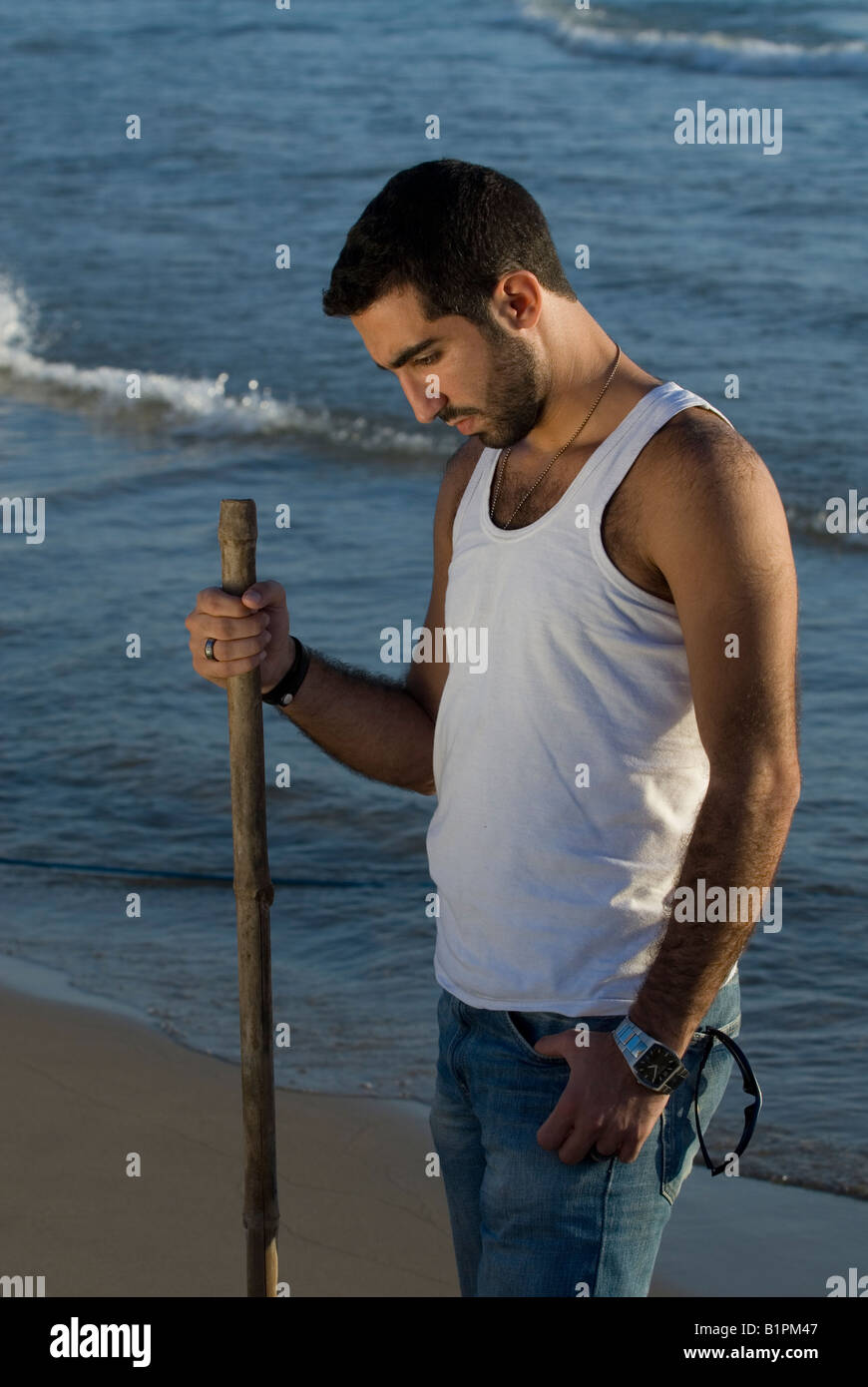 Portrait of a Middle Eastern man standing by the sea Stock Photo - Alamy