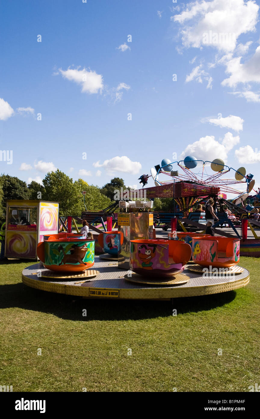 Spinning teacups - a fairground ride Stock Photo - Alamy