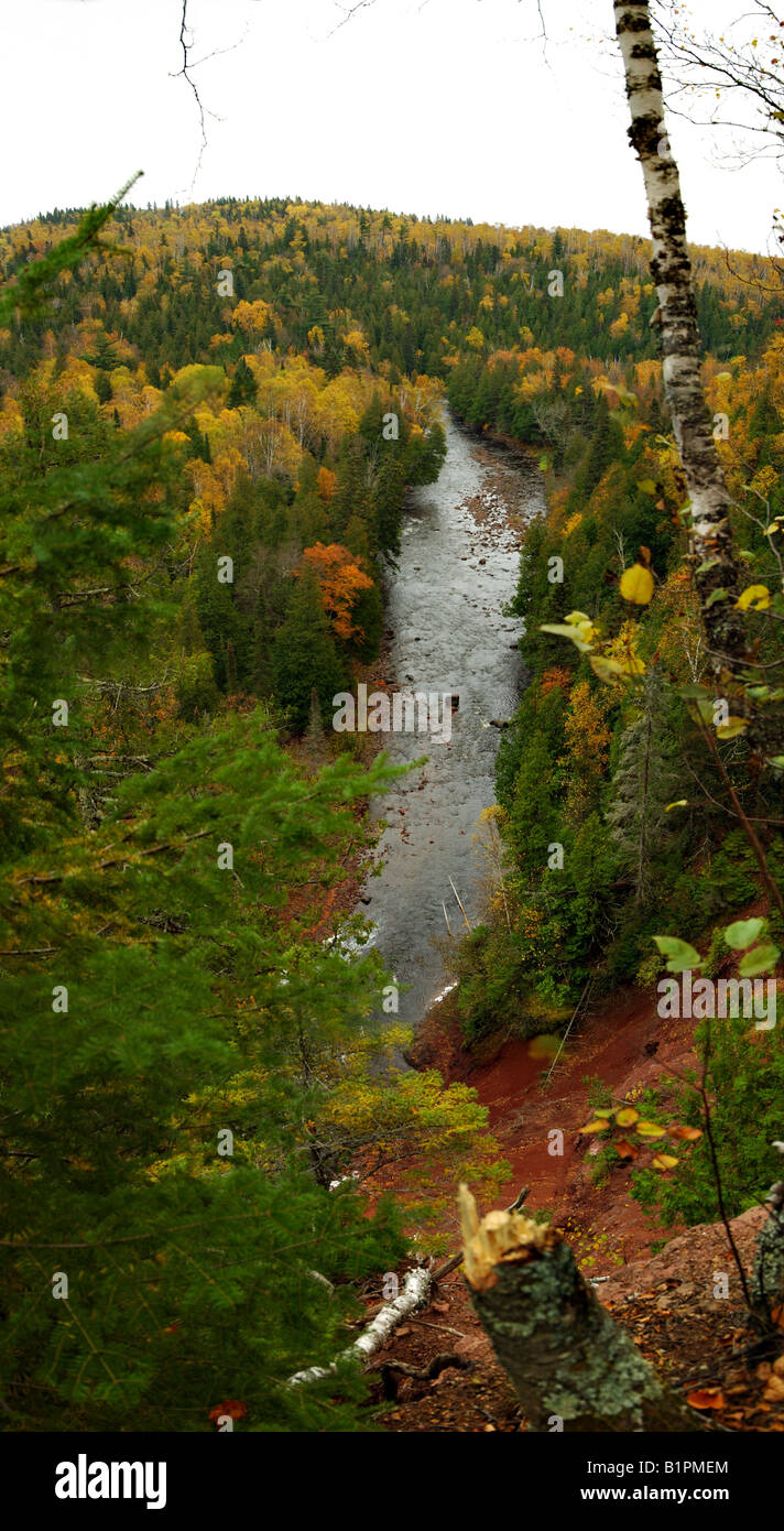 Manitou River running through fall forest in George Cosby state park ...