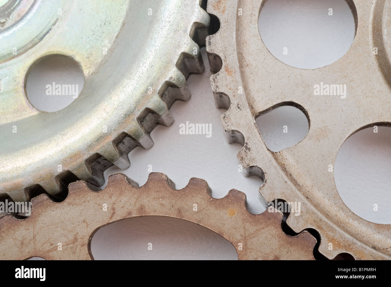 three cogwheels isolated on white Stock Photo - Alamy