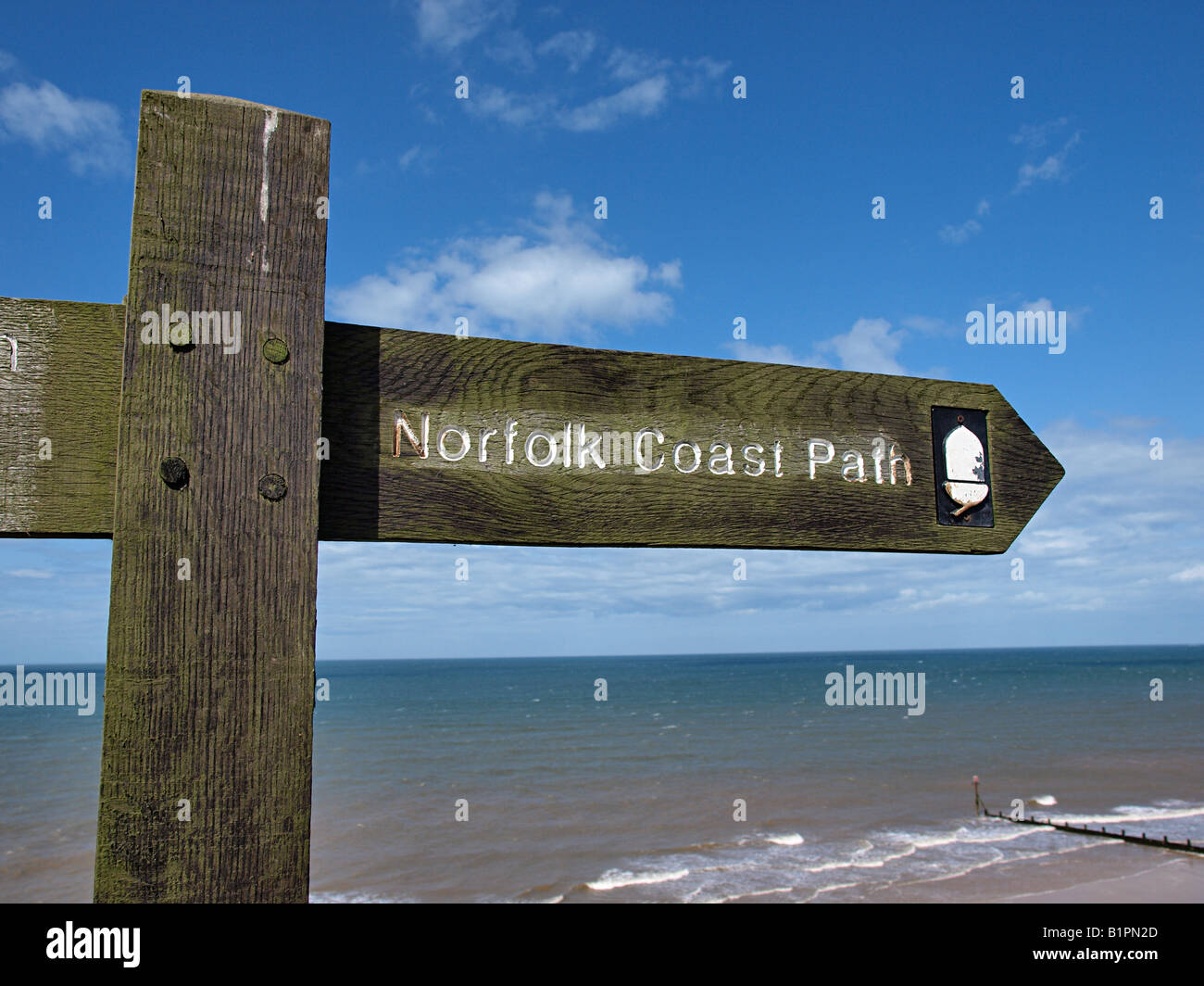 WOODEN FINGER POST SHOWING DIRECTION OF NORFOLK COAST PATH AT ...