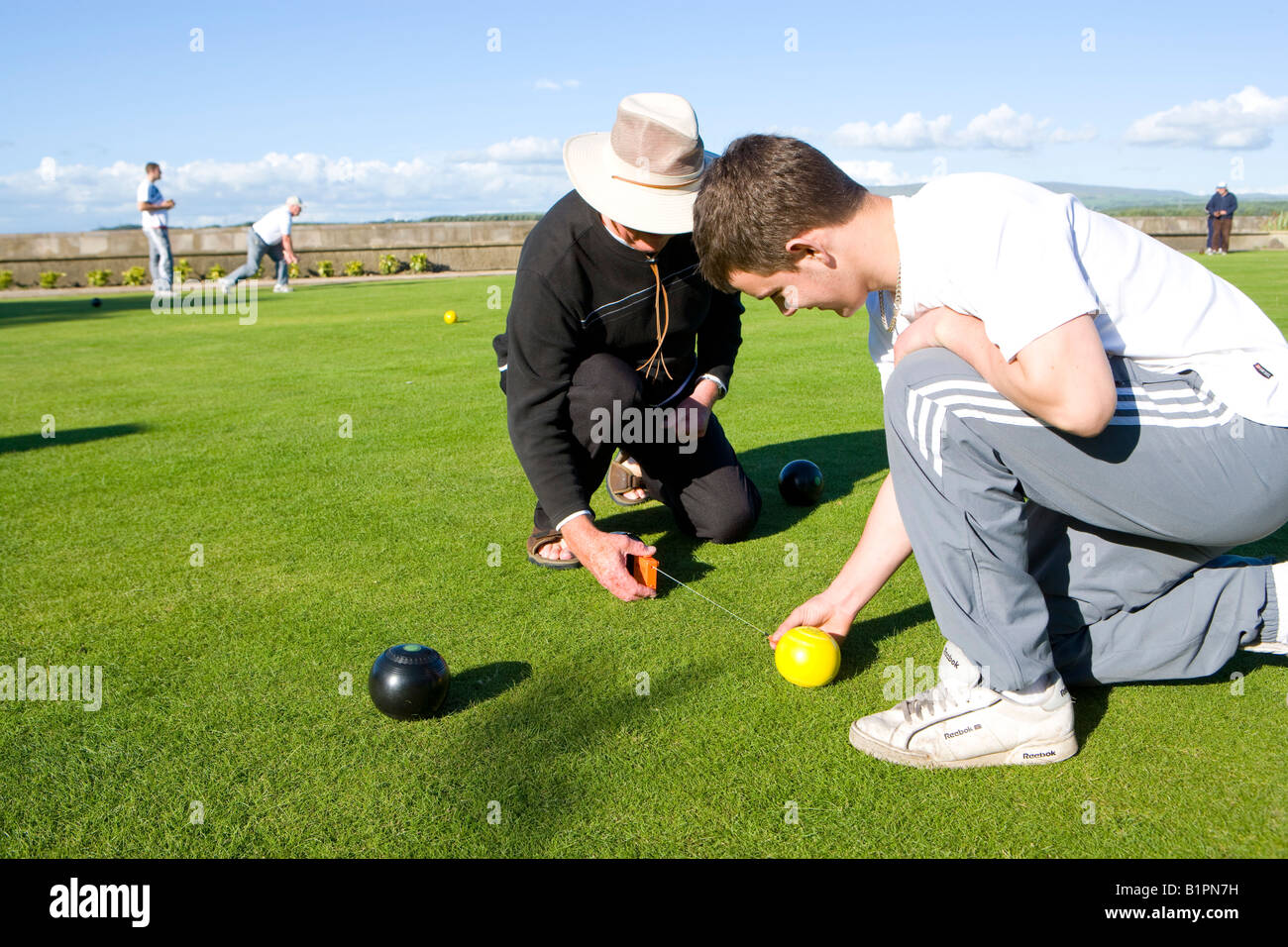 bowlers measuring the distance between balls Stock Photo - Alamy