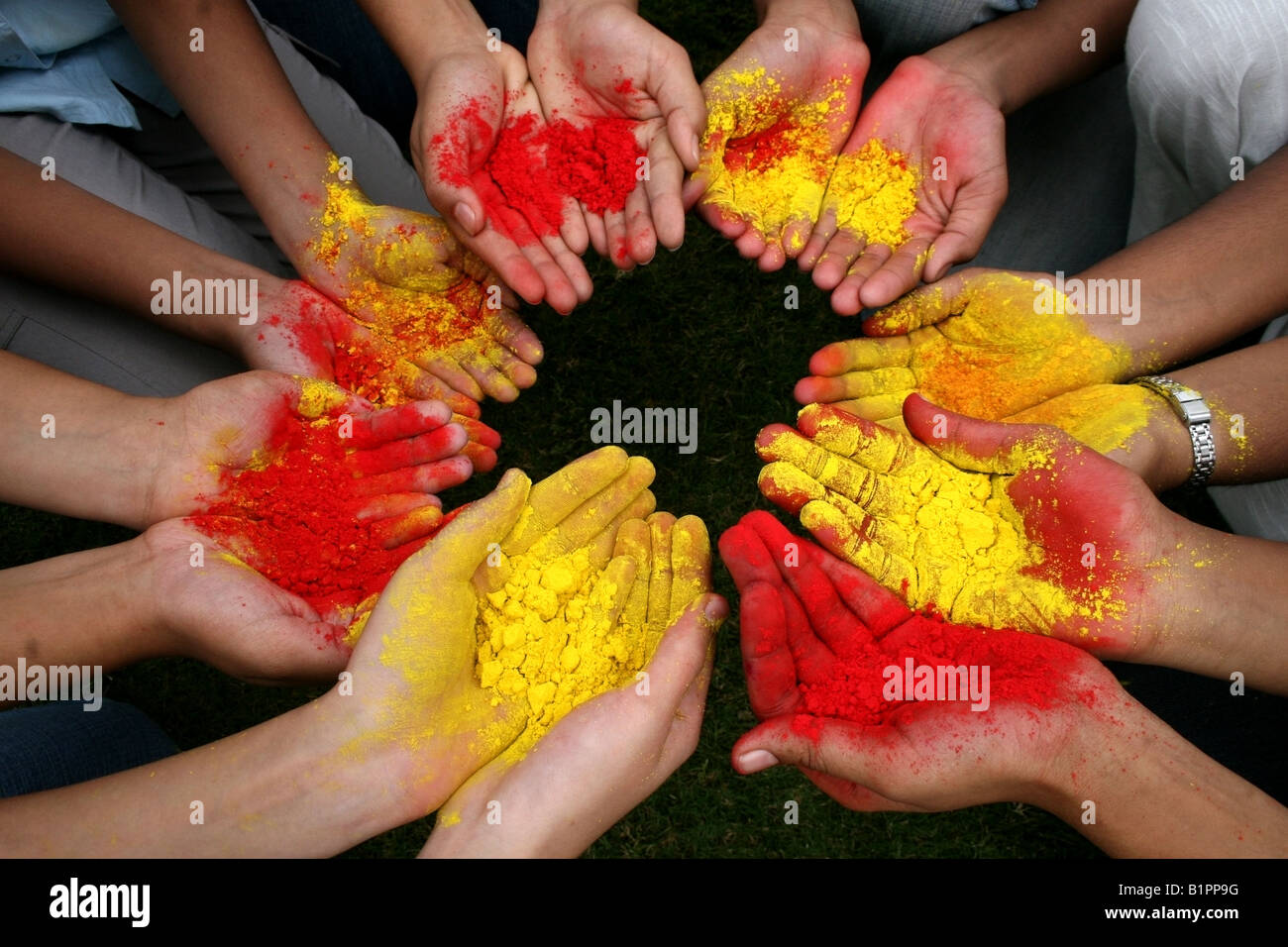 Teenagers hands showing yellow and red Holi powder , Holi celebrations ...