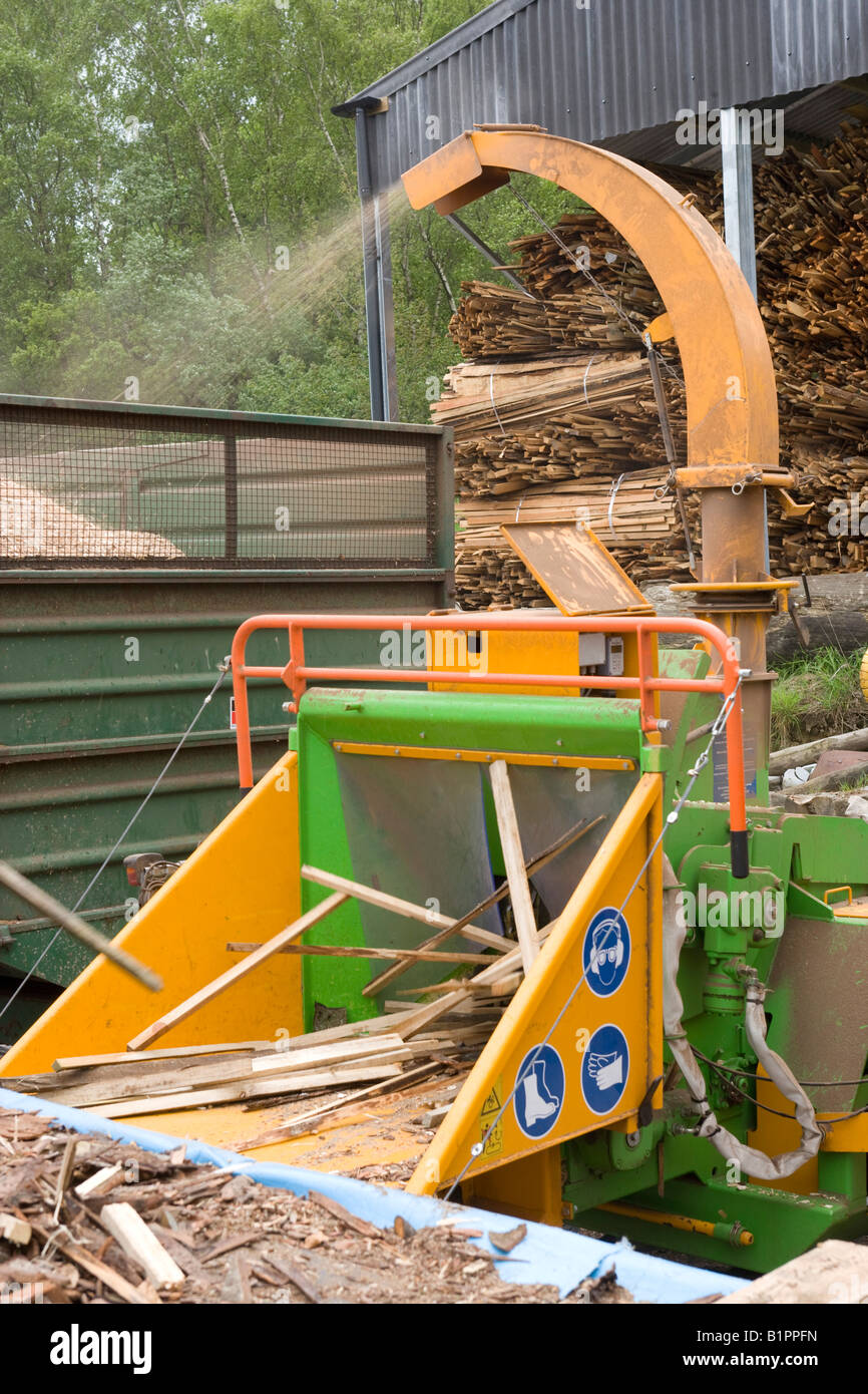 Large shredder chipping wood Stock Photo - Alamy