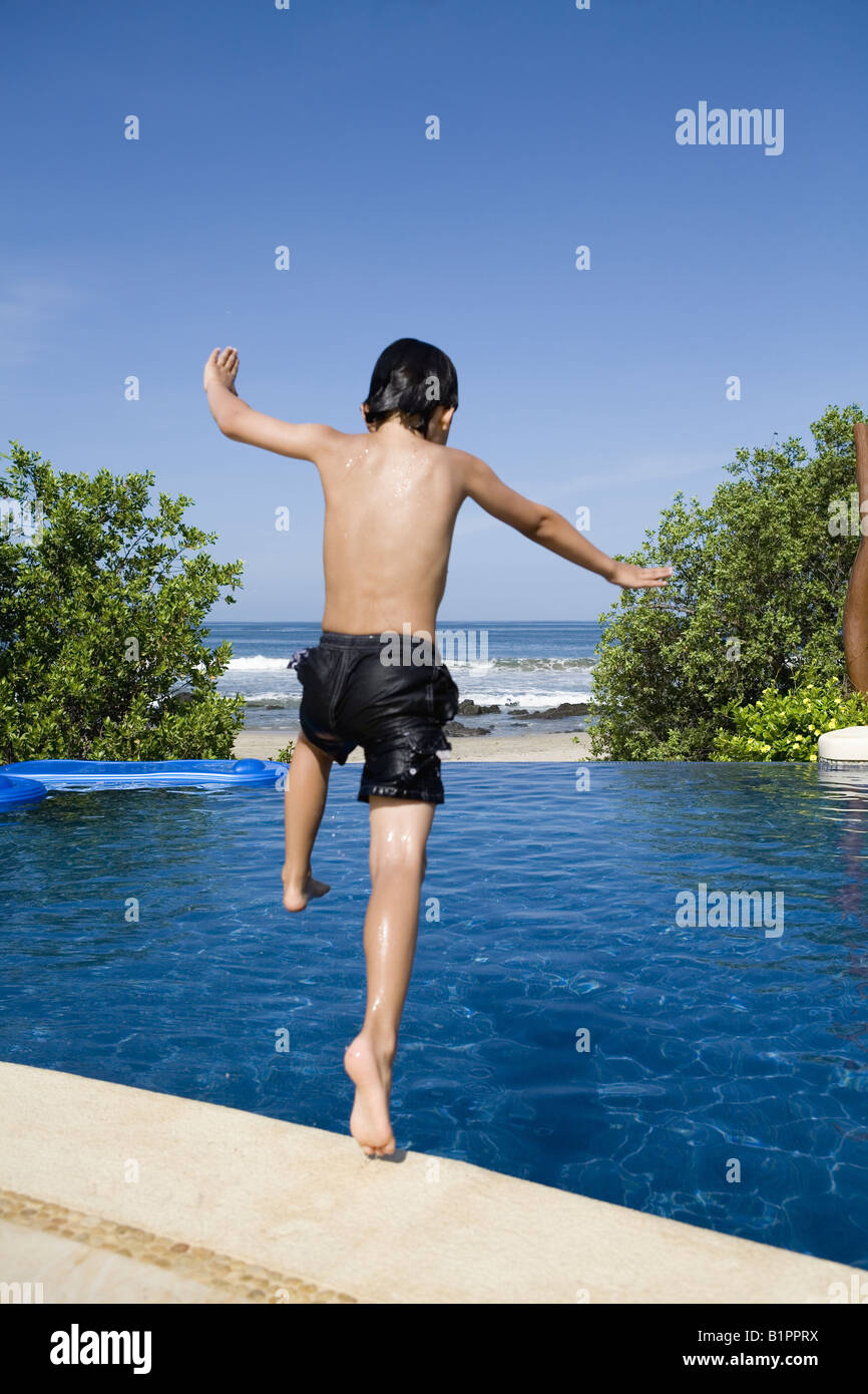 Young man beach alone splash swimming hi-res stock photography and ...
