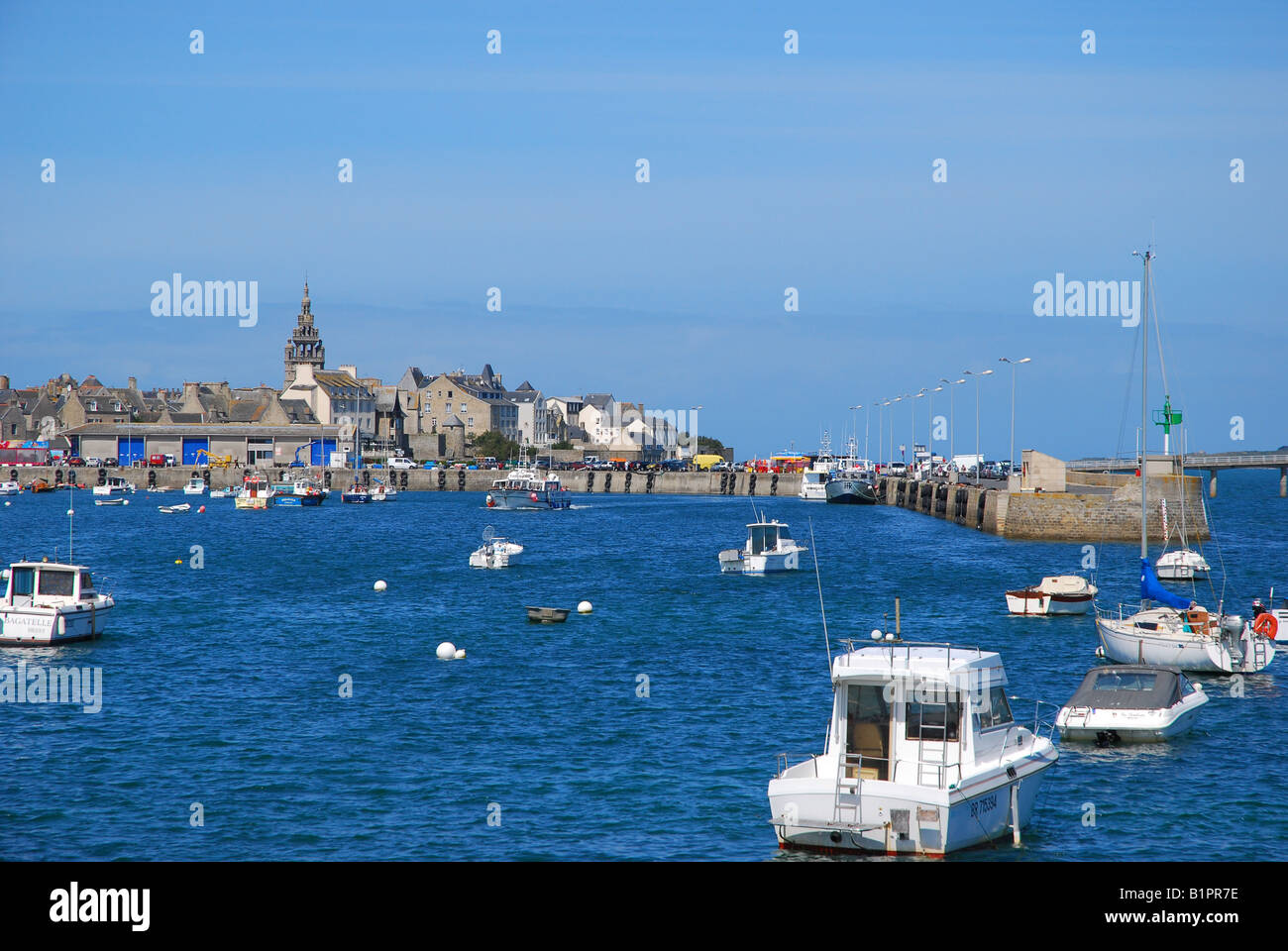Roscoff harbour with sea and boats background Stock Photo - Alamy