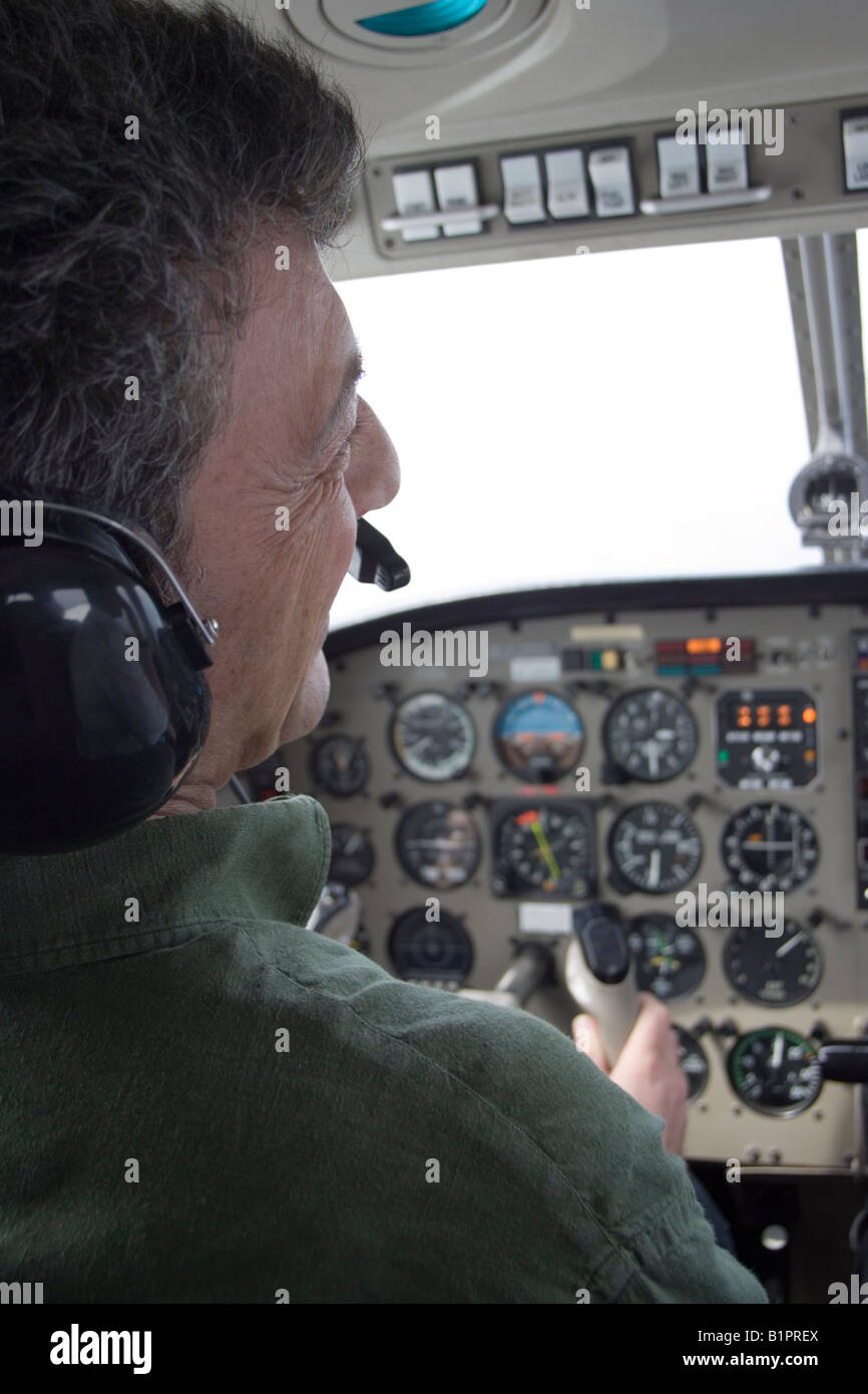 A man receiving a flying lesson in a light aircraft Stock Photo - Alamy