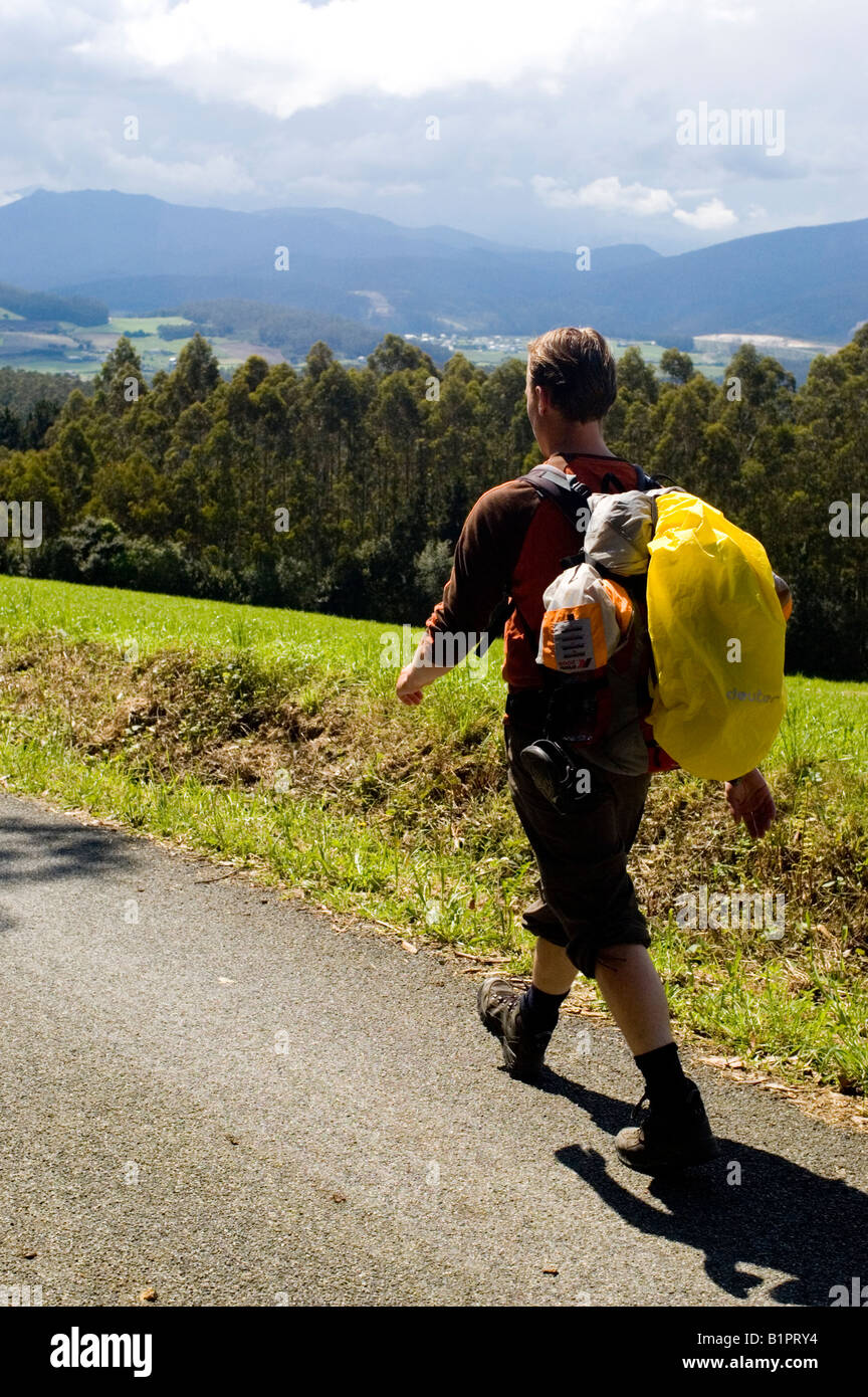 Pilgrim walking the WAY OF SAINT JAMES or CAMINO DE SANTIAGO Northern ...
