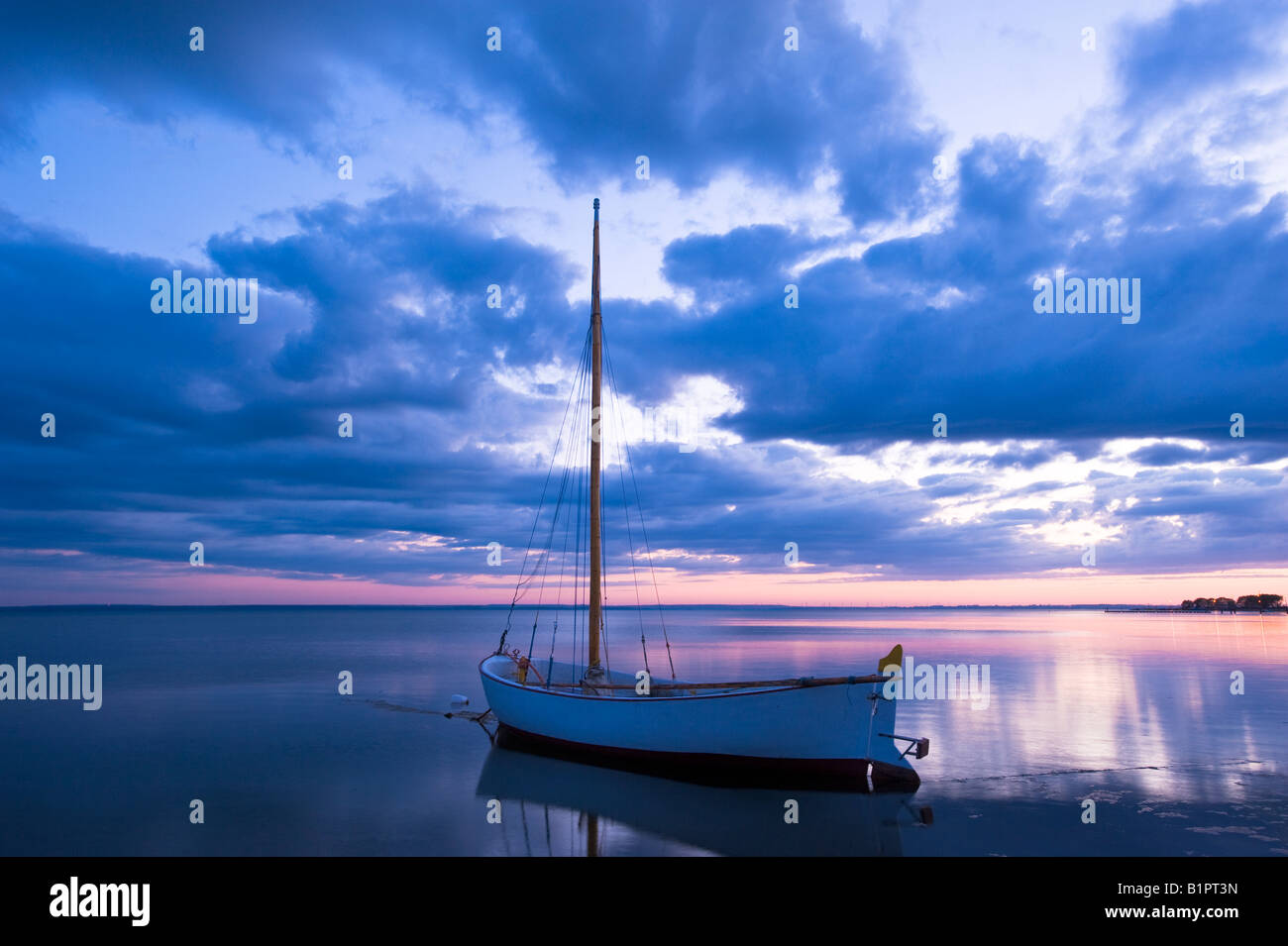 Moored boat on calm water at dusk Puck Bay Baltic Sea Poland Stock ...