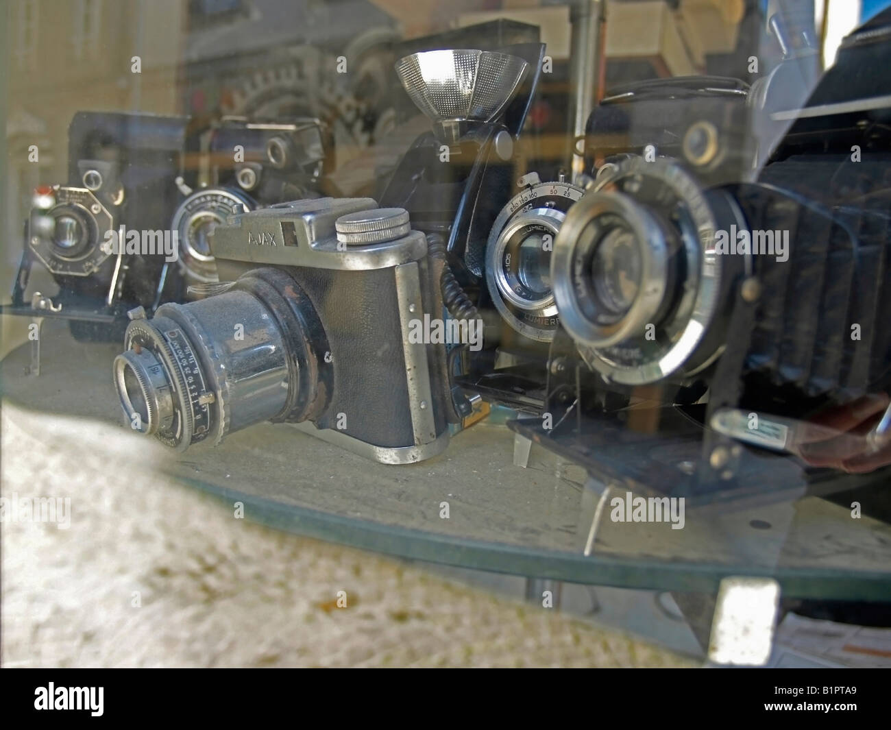 old historical analog cameras on display in shop window Stock Photo - Alamy