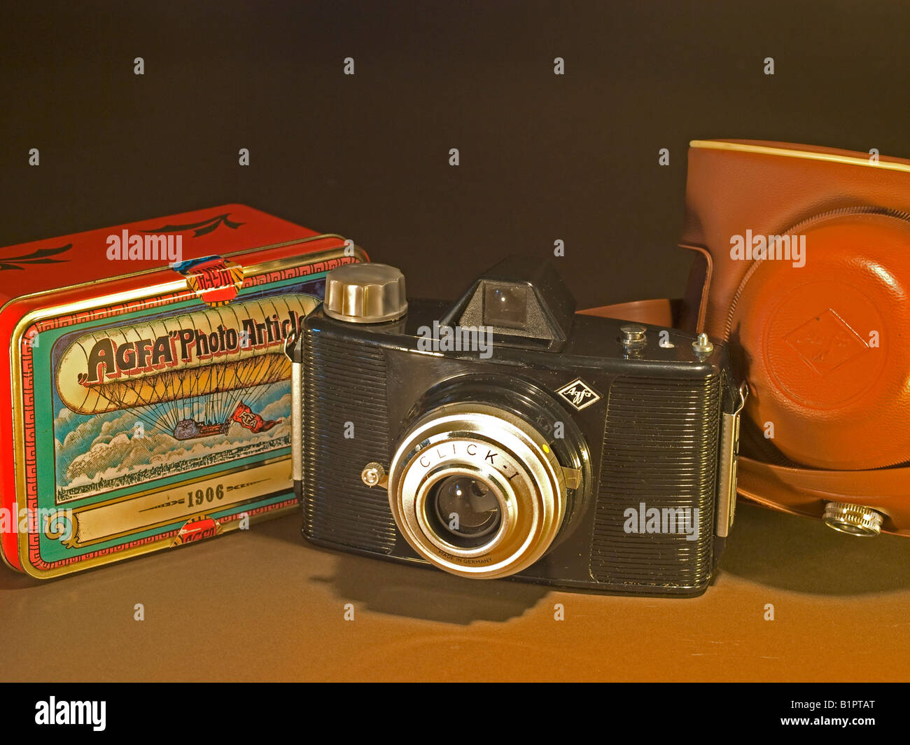 old historic tin for films with an old camera Agfa Click Stock Photo ...