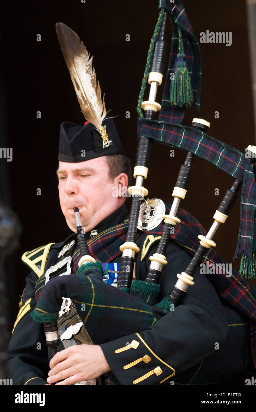 A piper from the Royal Regiment Of Scotland plays a lament on the ...