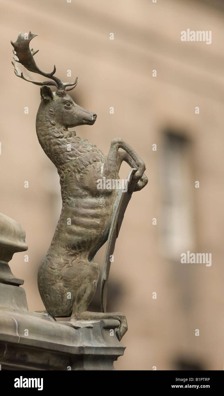 A small statute of a stag holding a shield outside St Giles' Cathedral ...