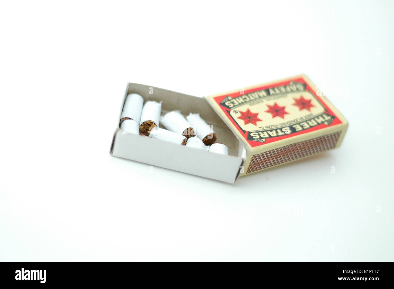 A traditional matchbox filled with pieces of cigarettes Stock Photo - Alamy