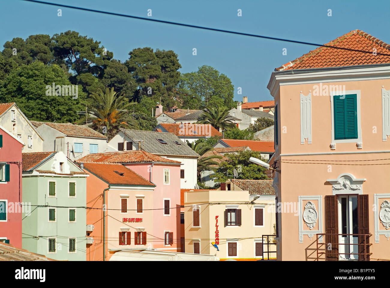 pastel coloured houses at the Port bassin in the town Veli Losinj on ...
