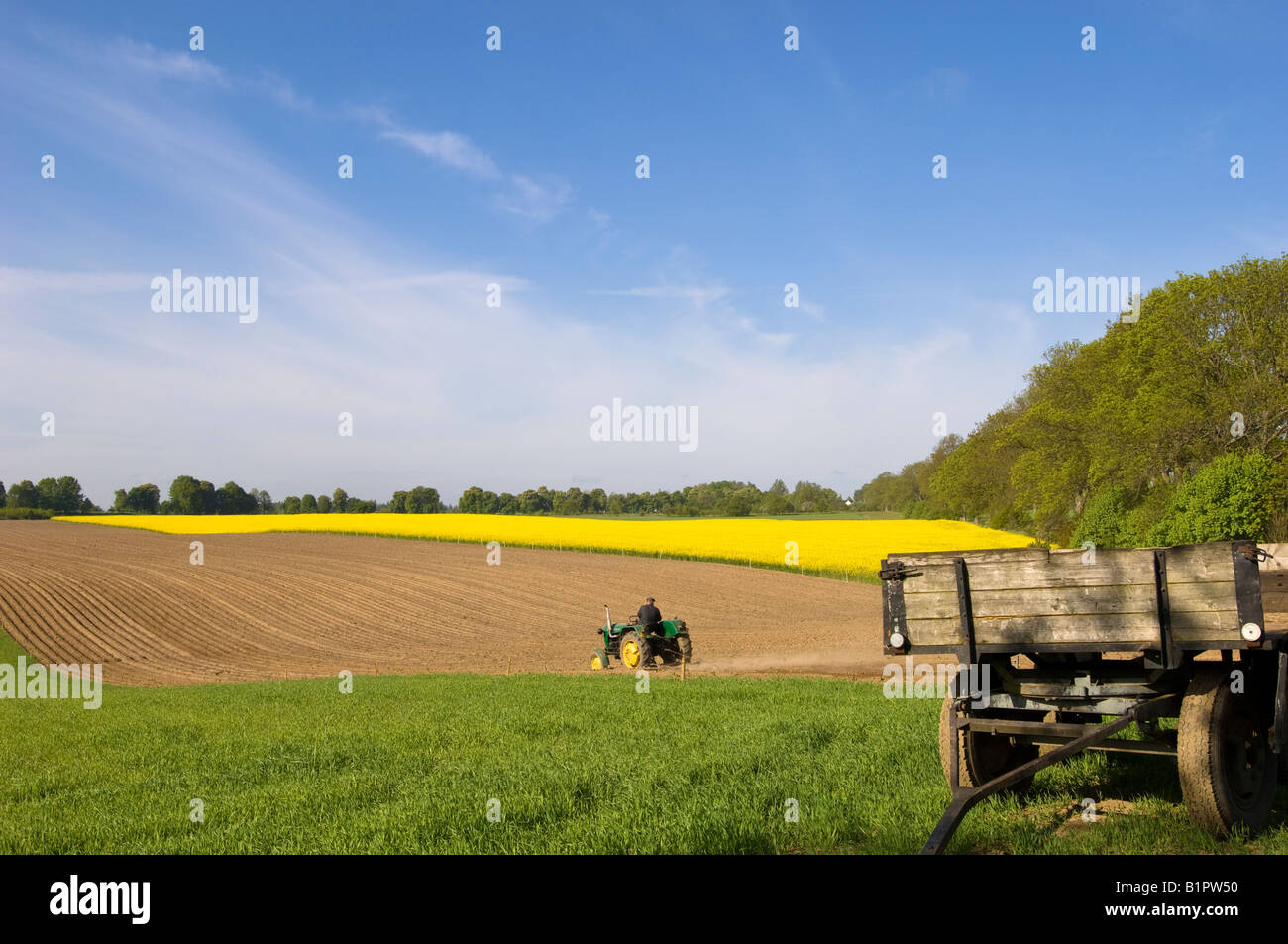 Farmer in a tractor cultivating his land Kaszuby region Poland Stock ...