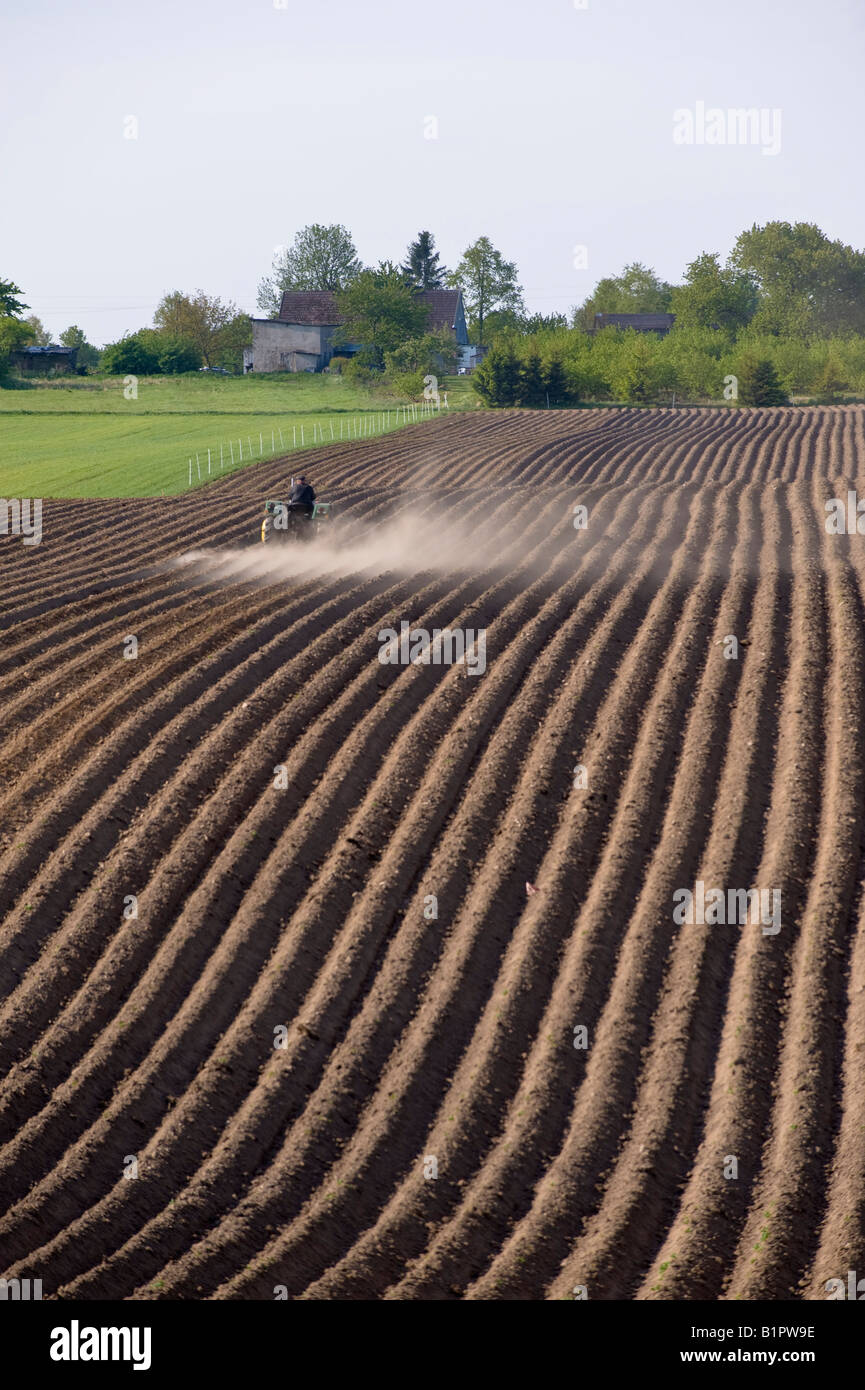 Farmer in a tractor cultivating his land Kaszuby region Poland Stock ...