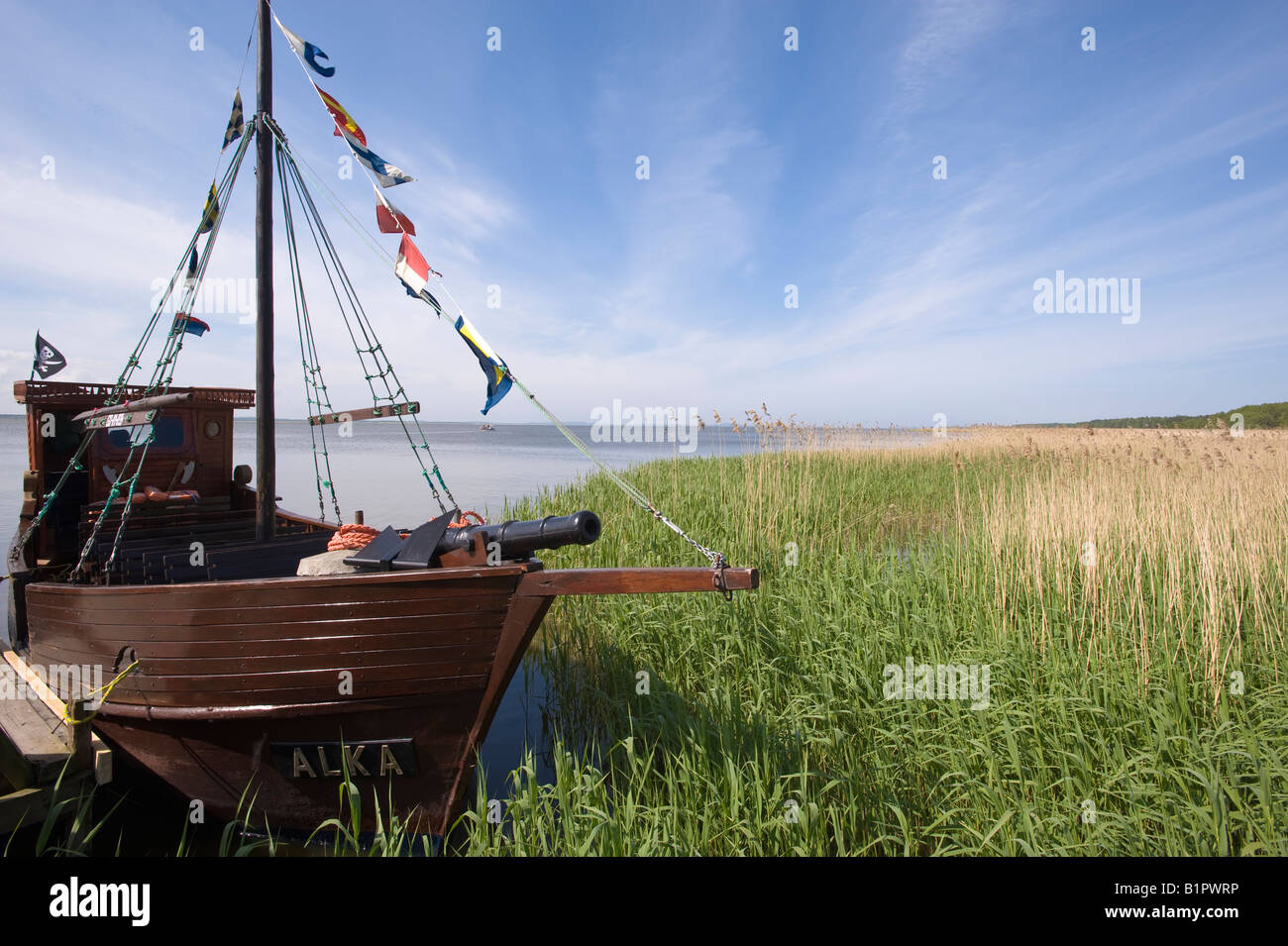 Tourists in leisure boat crossing Lebskie Lake near Leba Slowinski ...
