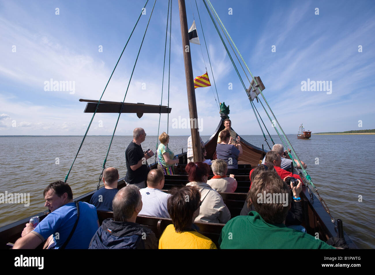 Tourists in leisure boat crossing Lebskie Lake near Leba Slowinski ...