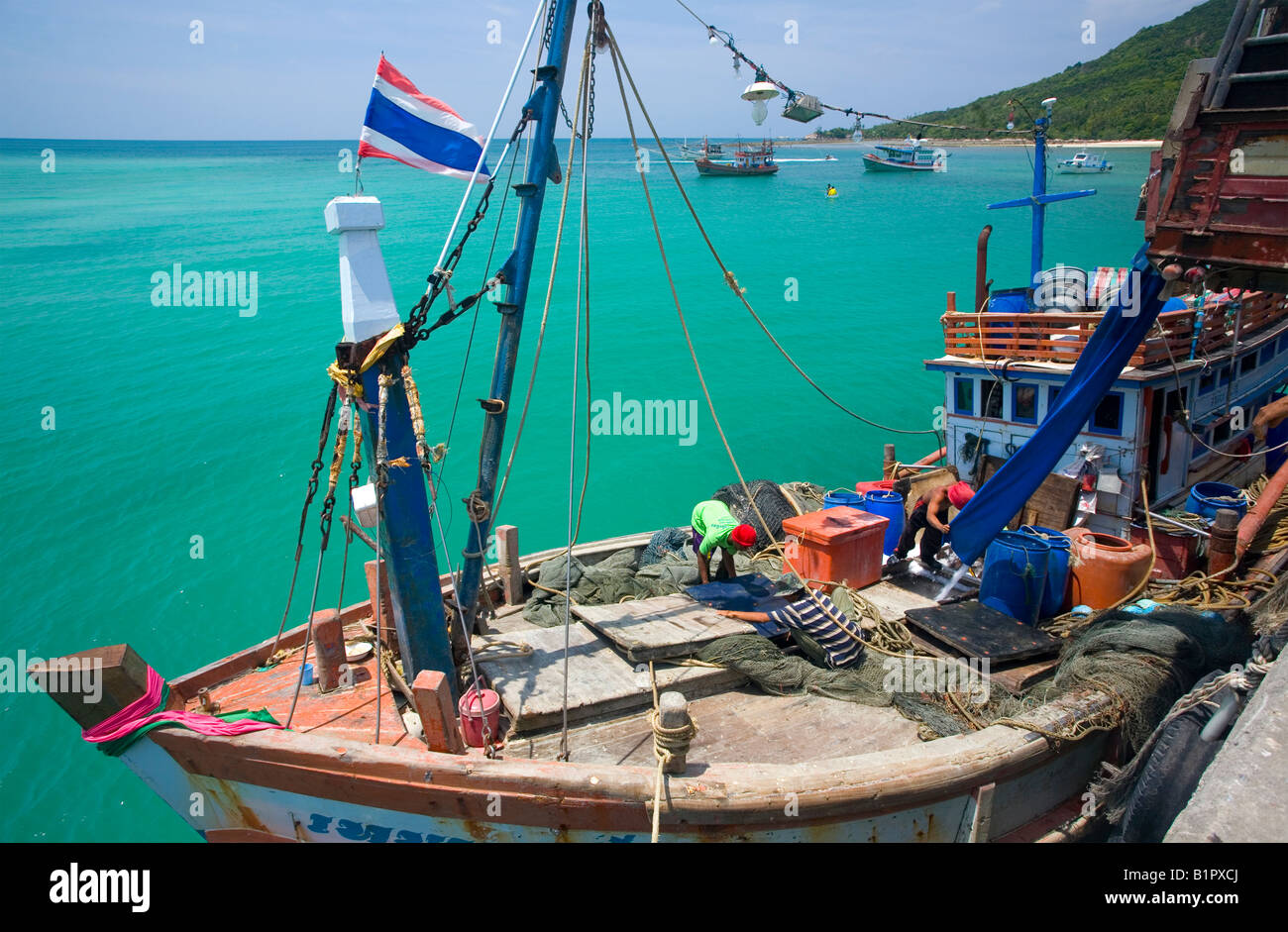 Thai fishing boat loading ice Stock Photo - Alamy