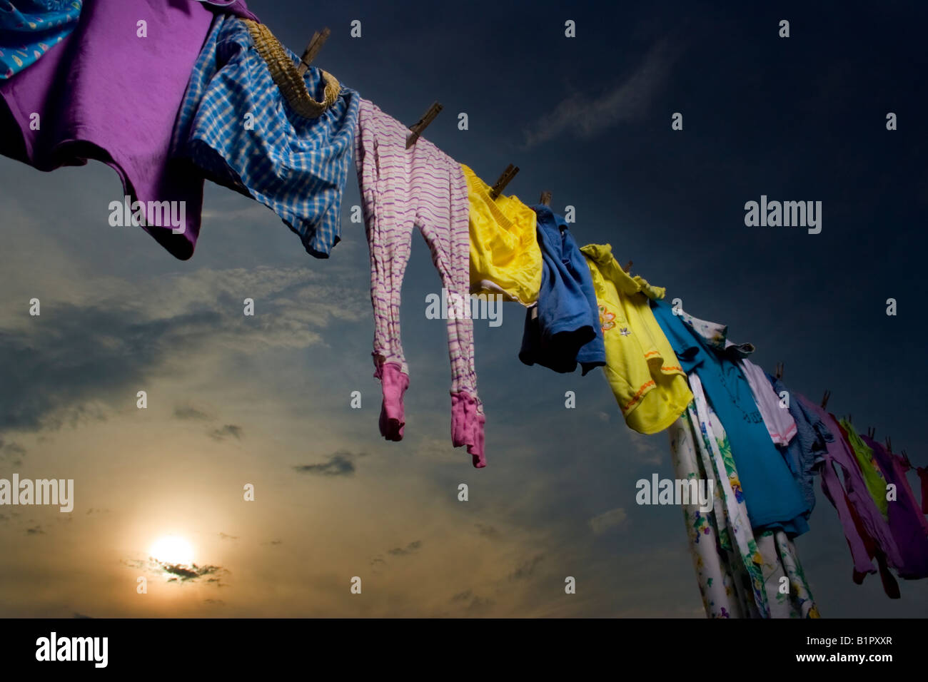 Clothes hanging on line at sunset Stock Photo - Alamy