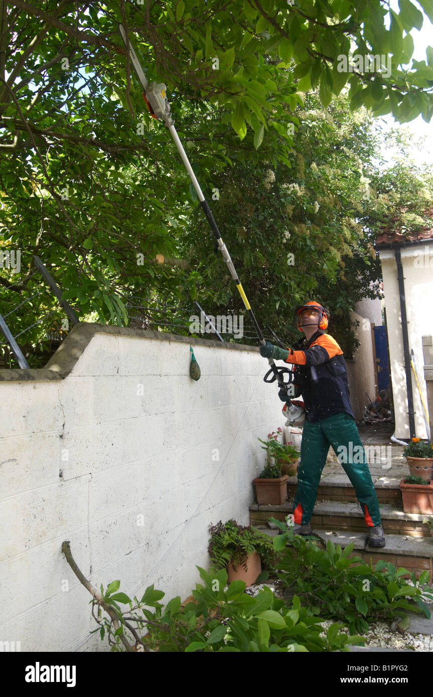Man in full protective STIHL power tool clothing using a Combi Engine ...