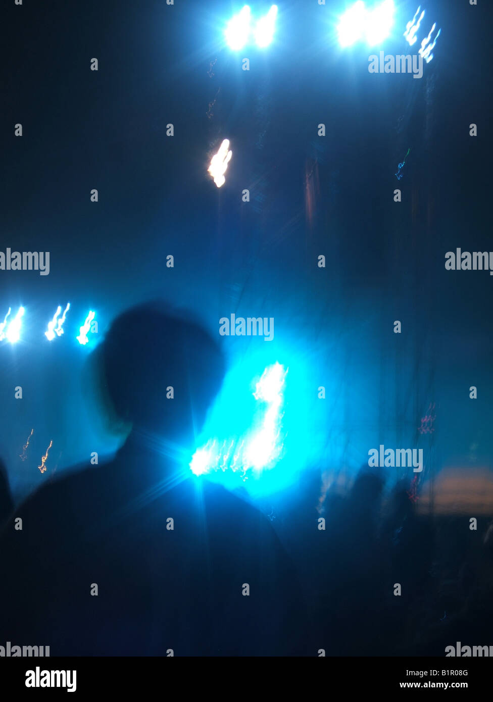 crowd of revellers at music concert gig at night Stock Photo - Alamy