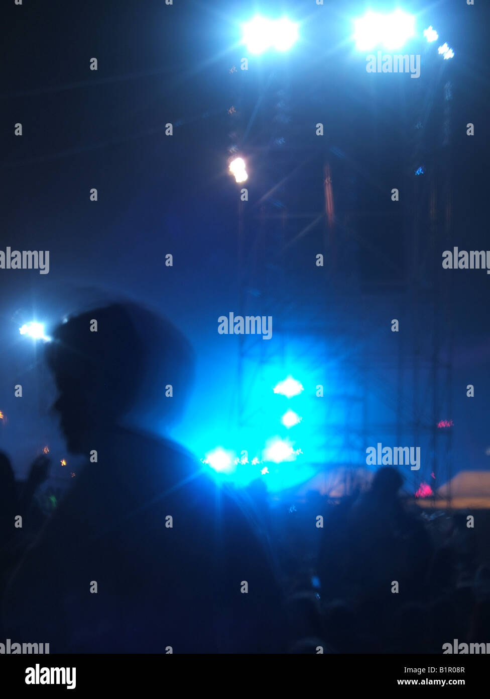 crowd of revellers at music concert gig at night Stock Photo - Alamy