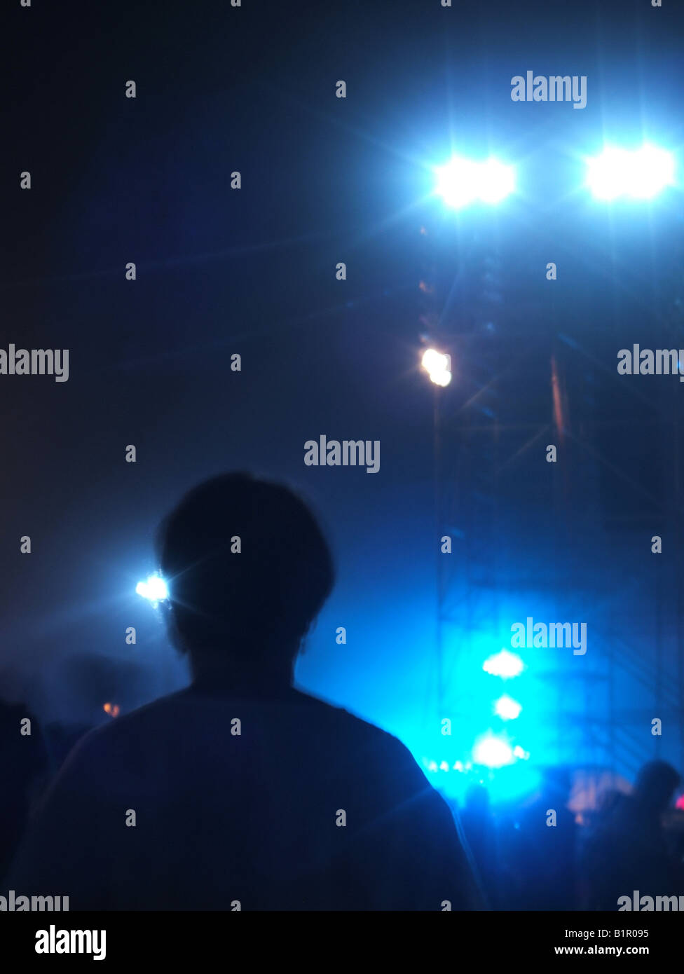 crowd of revellers at music concert gig at night Stock Photo - Alamy
