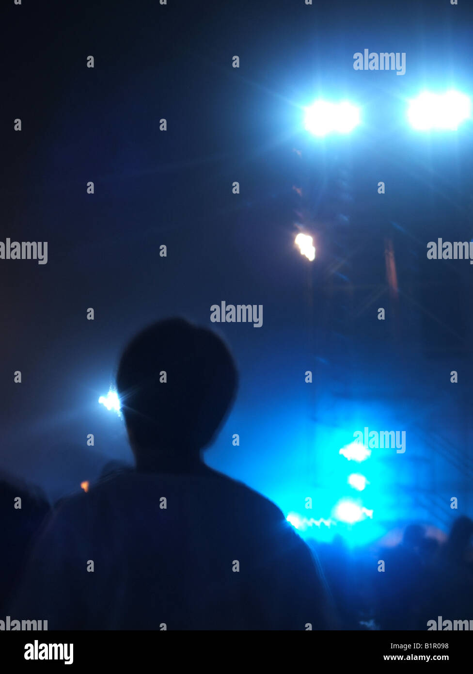 crowd of revellers at music concert gig at night Stock Photo - Alamy