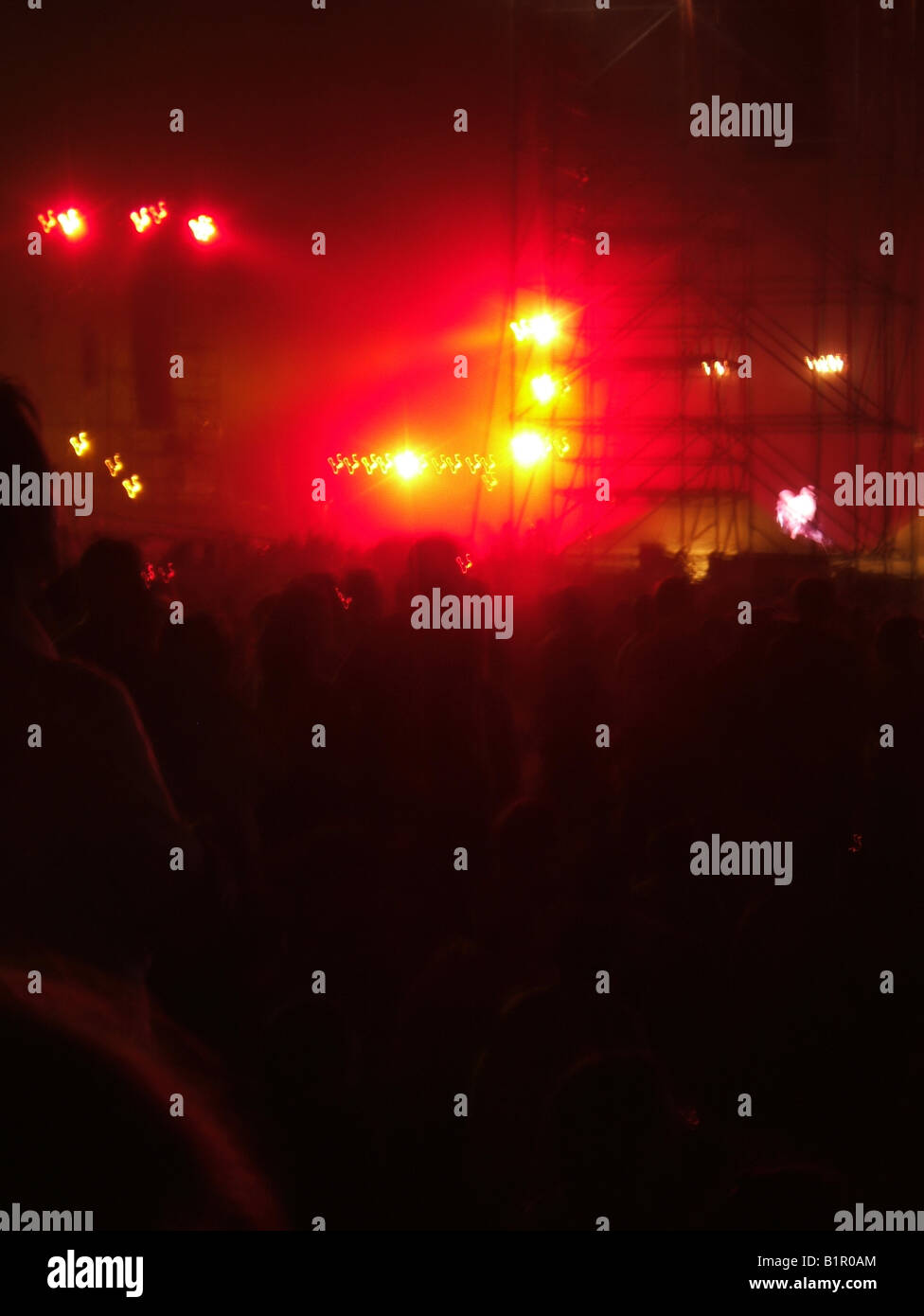 crowd of revellers at music concert gig at night Stock Photo - Alamy