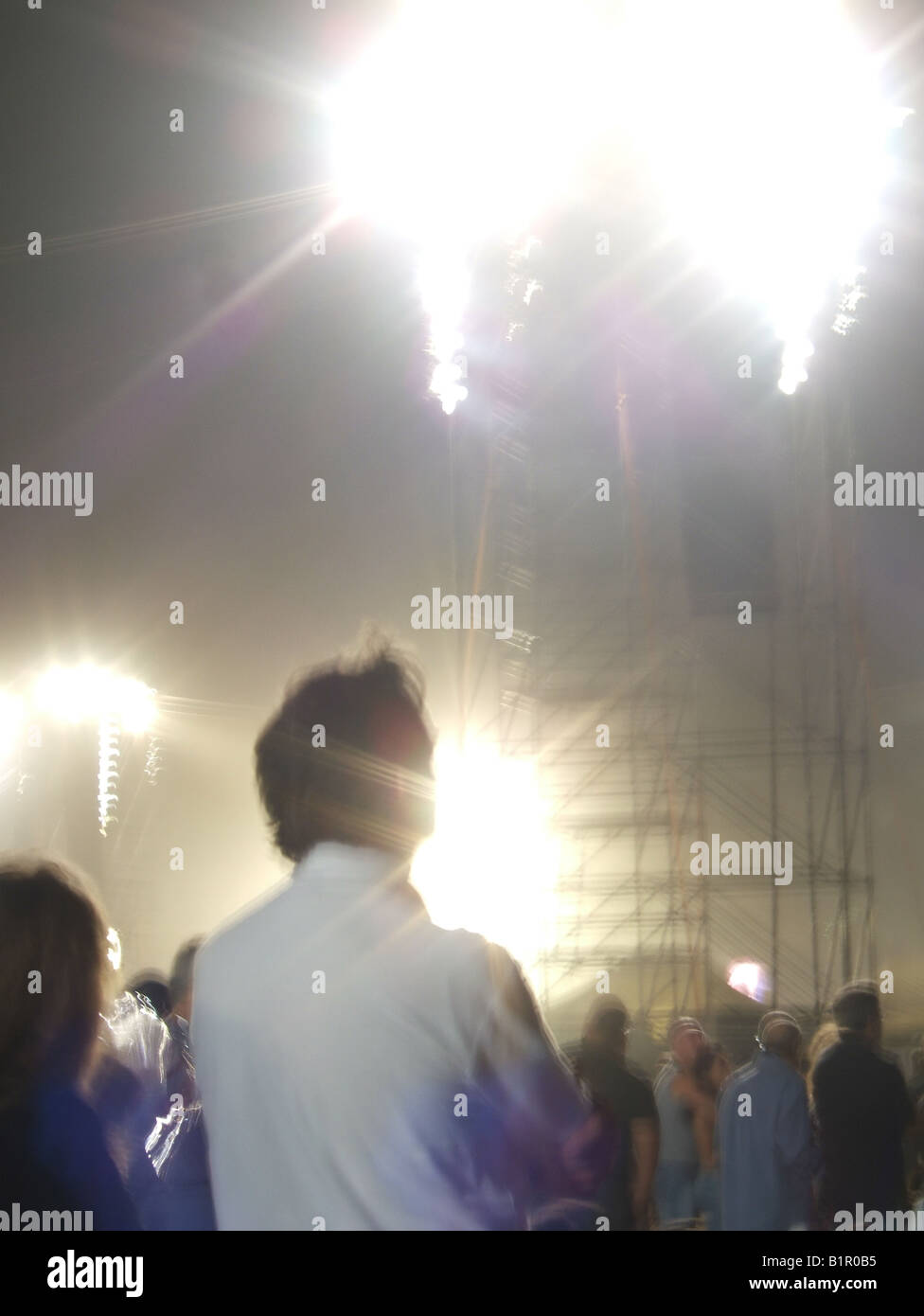 crowd of revellers at music concert gig at night Stock Photo - Alamy