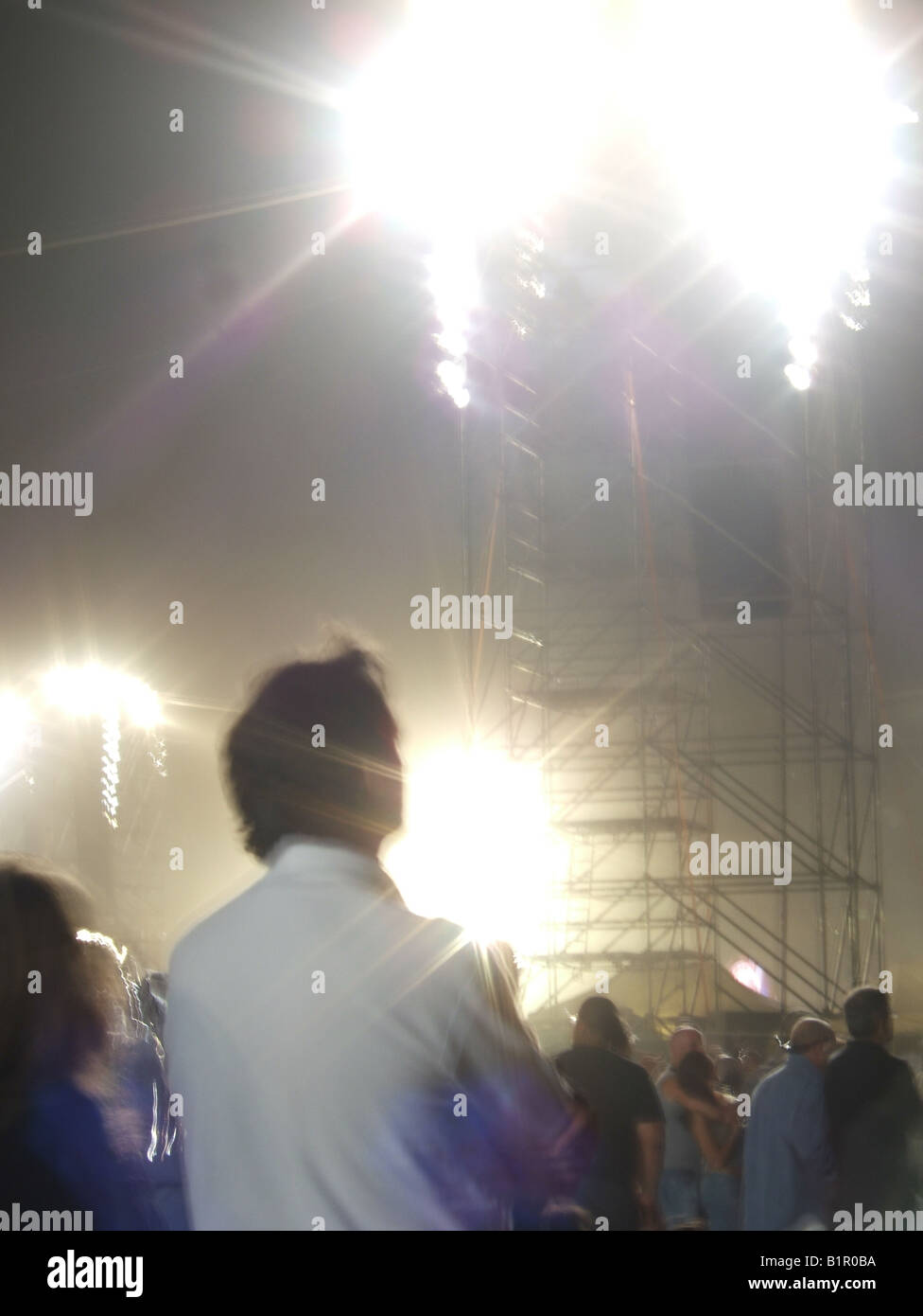 crowd of revellers at music concert gig at night Stock Photo - Alamy