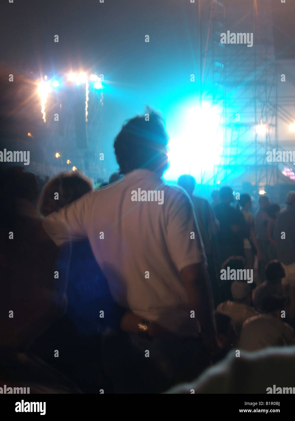 crowd of revellers at music concert gig at night Stock Photo - Alamy