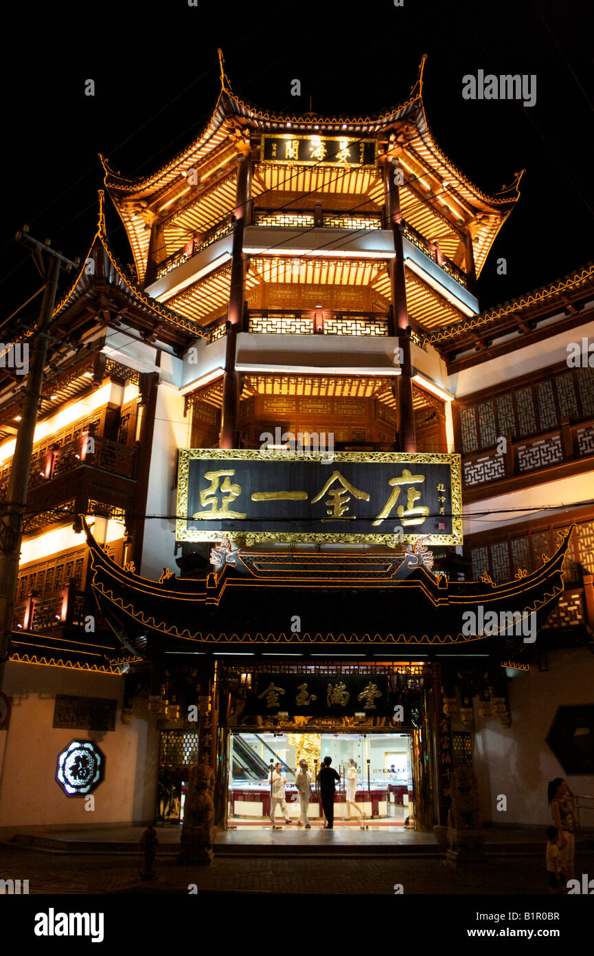 The entrance to a Chinese style illuminated department store building ...