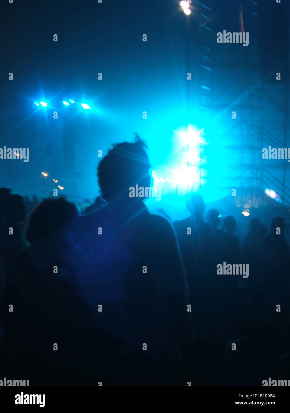 crowd of revellers at music concert gig at night Stock Photo - Alamy