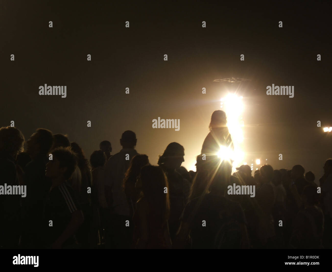 crowd of revellers at music concert gig at night Stock Photo - Alamy