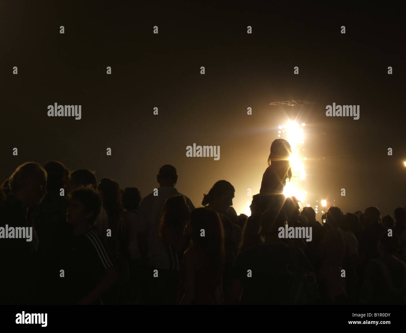 crowd of revellers at music concert gig at night Stock Photo - Alamy