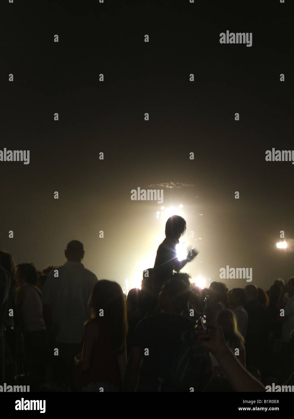 crowd of revellers at music concert gig at night Stock Photo - Alamy