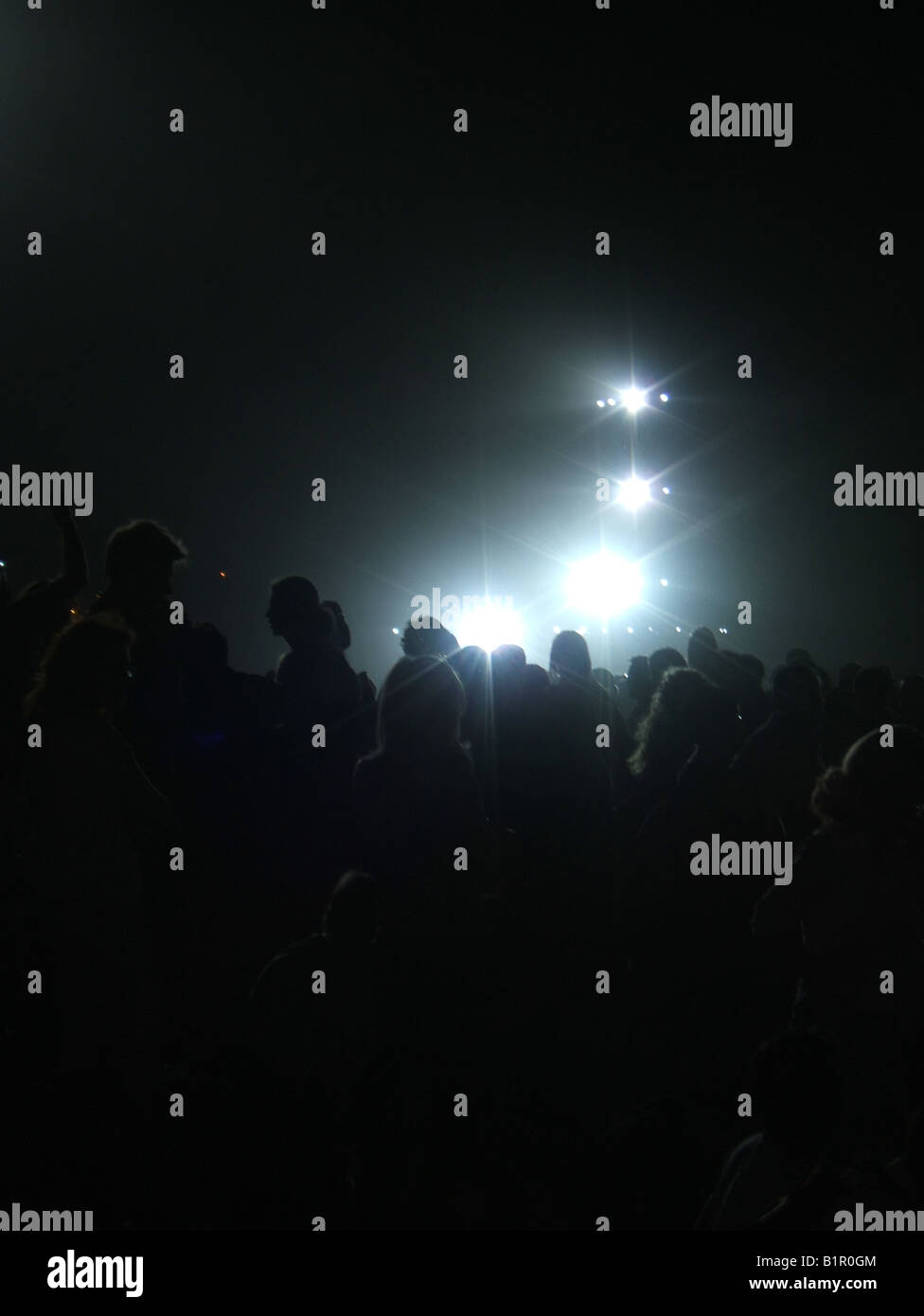 crowd of revellers at music concert gig at night Stock Photo - Alamy