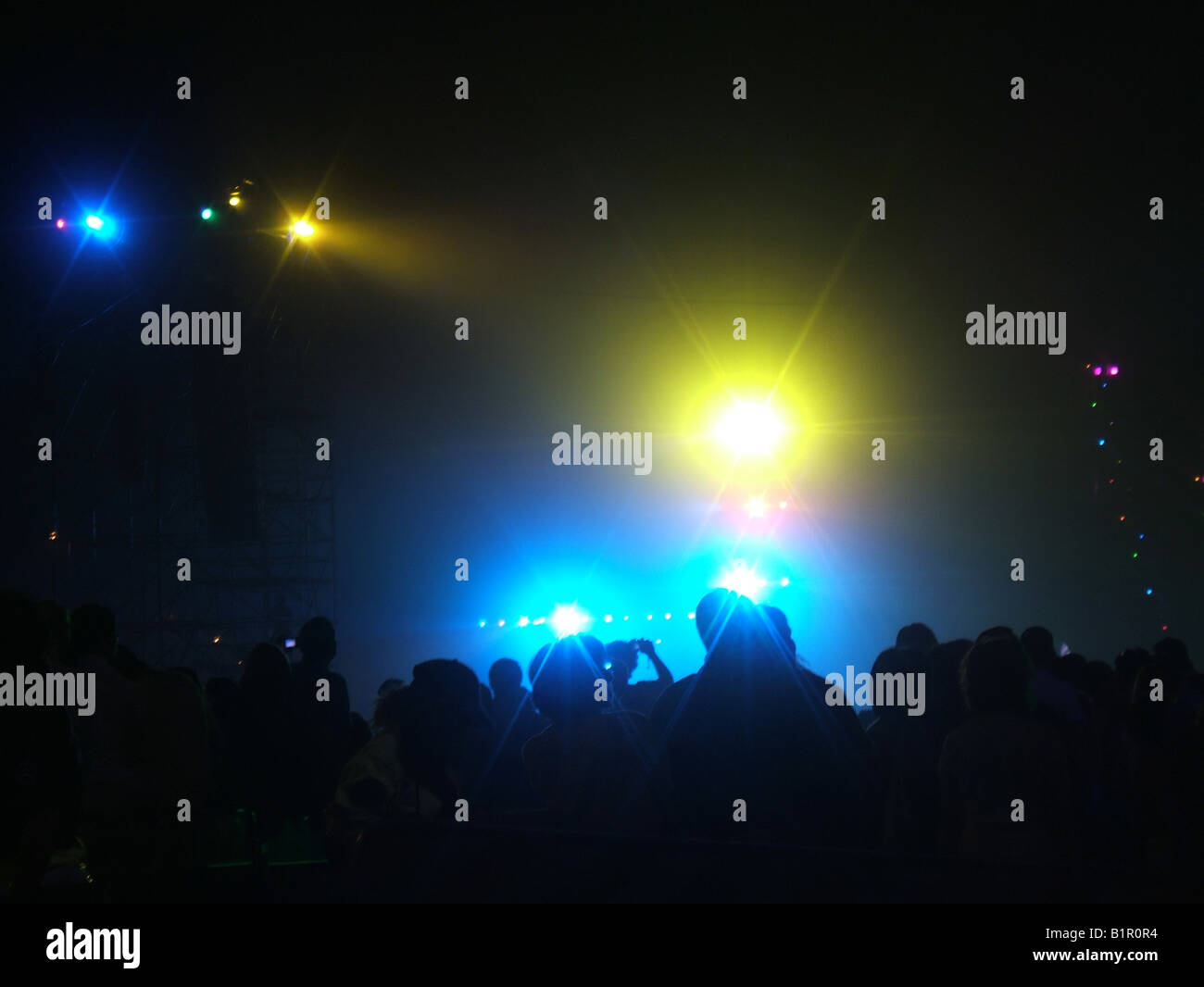 crowd of revellers at music concert gig at night Stock Photo - Alamy