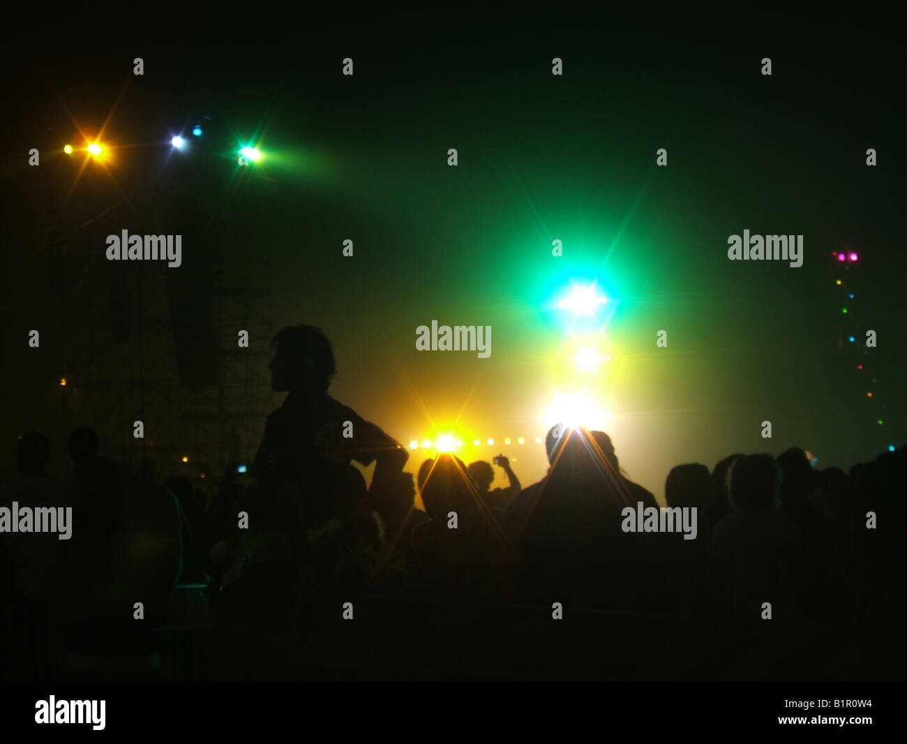 crowd of revellers at music concert gig at night Stock Photo - Alamy