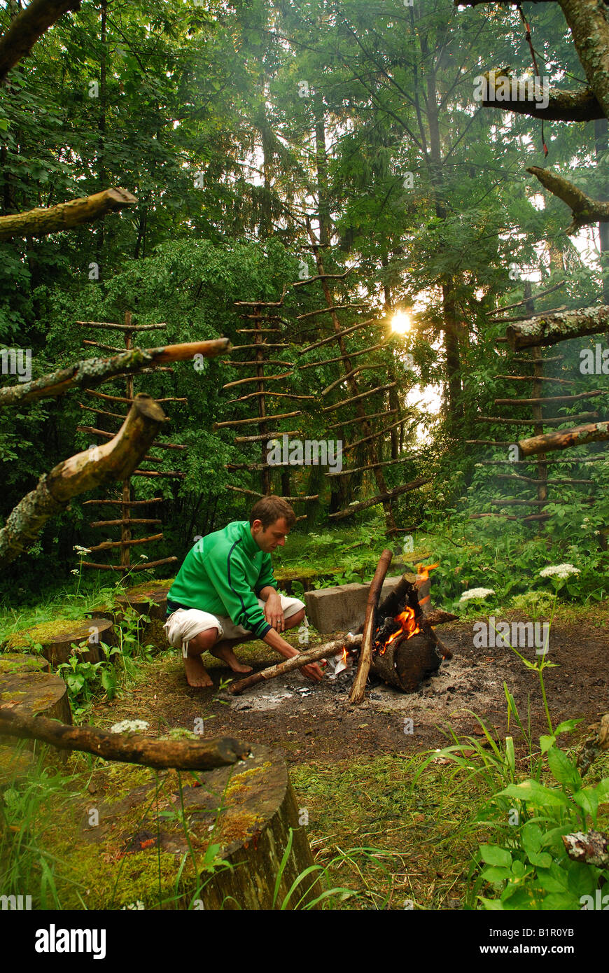 Man making open fire Stock Photo - Alamy