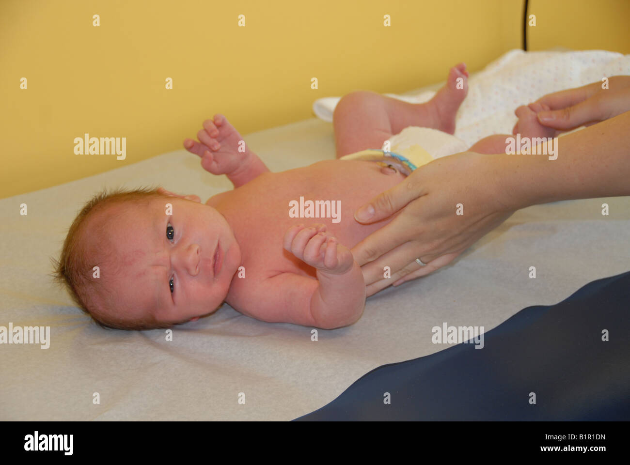 A newborn baby has his first checkup at the doctor's office Stock Photo ...